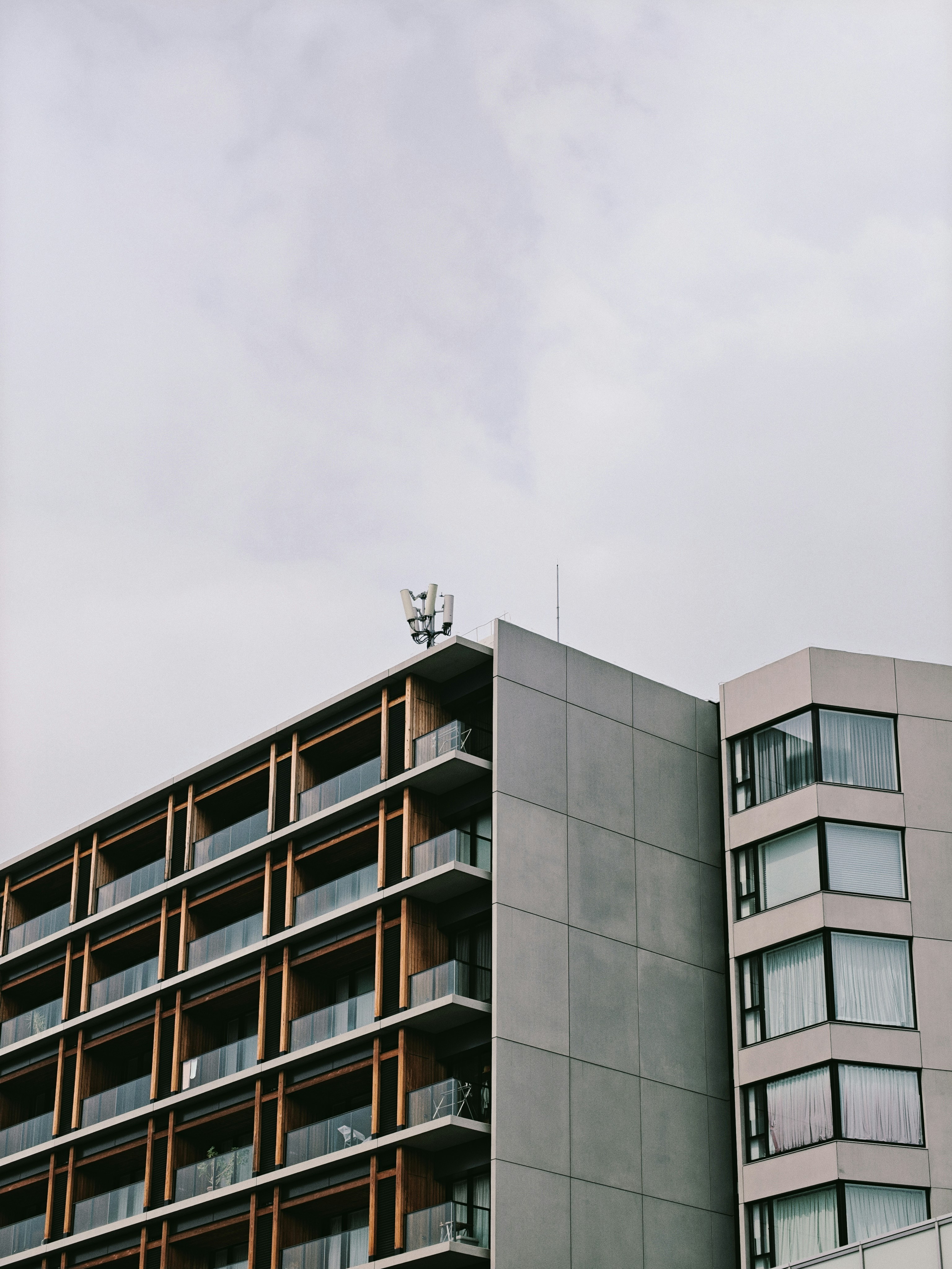 Modern buildings with balconies against a cloudy sky