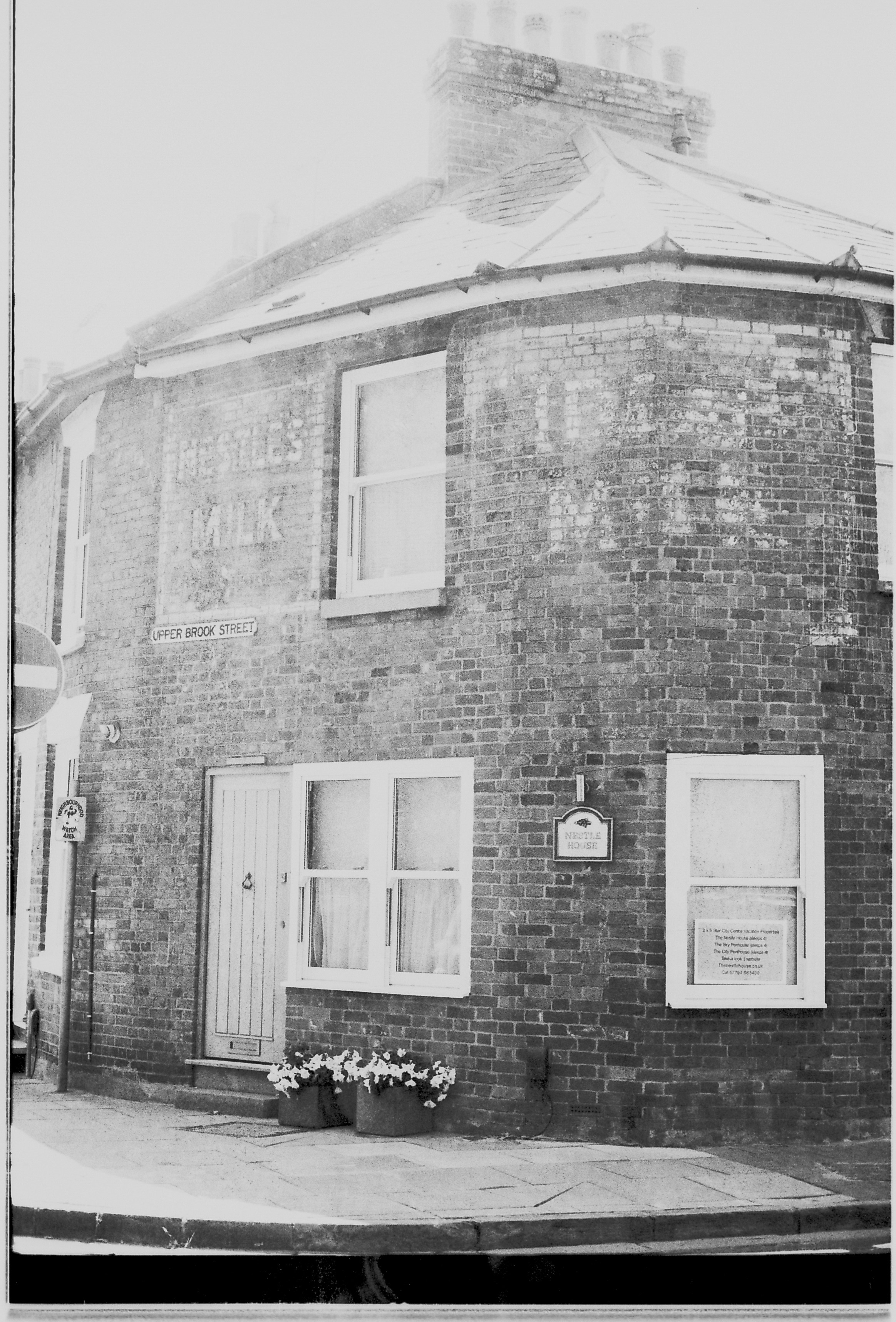 Brick building with windows and door