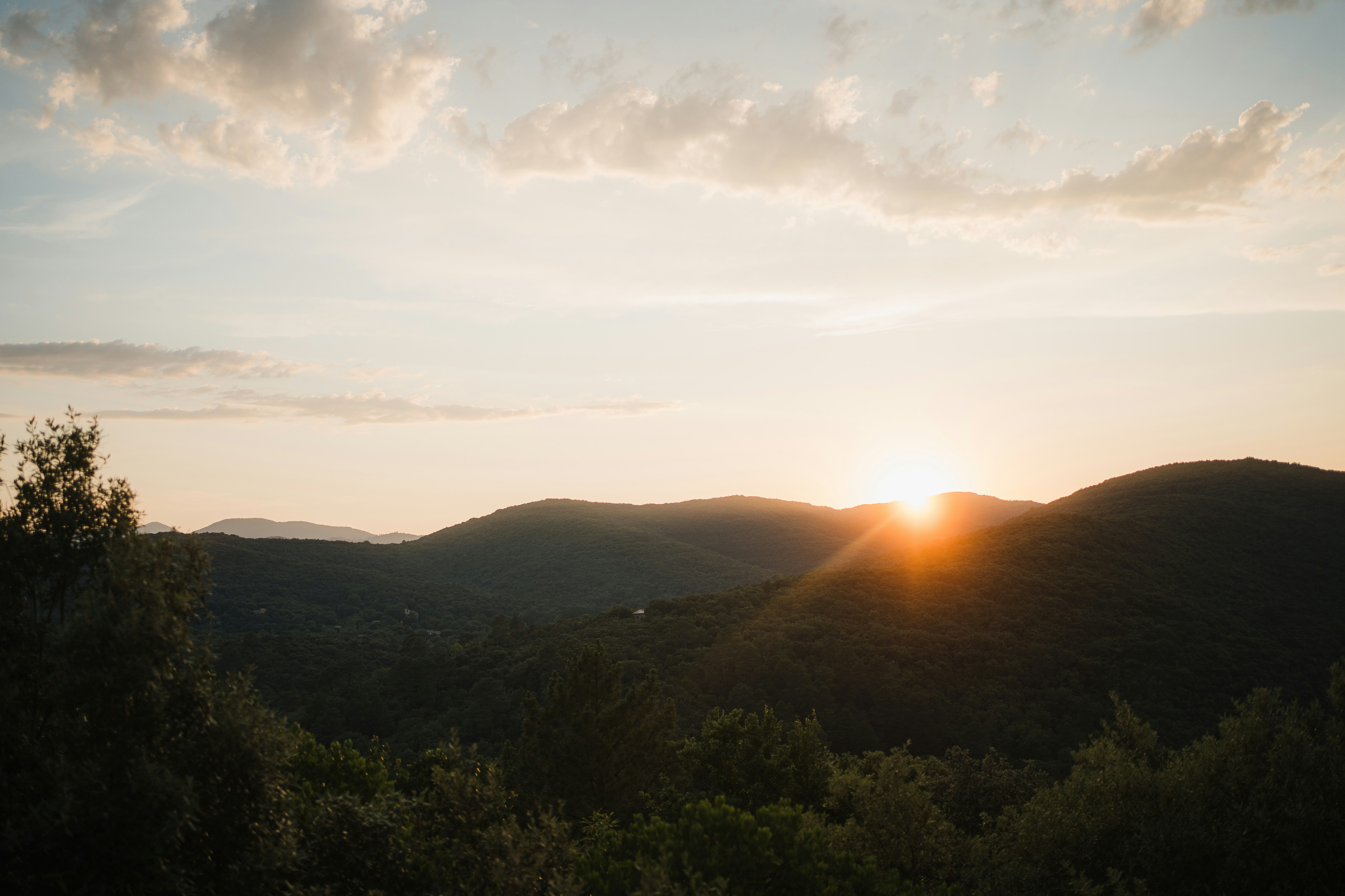Dusk's Embrace Over the Rolling Hills
