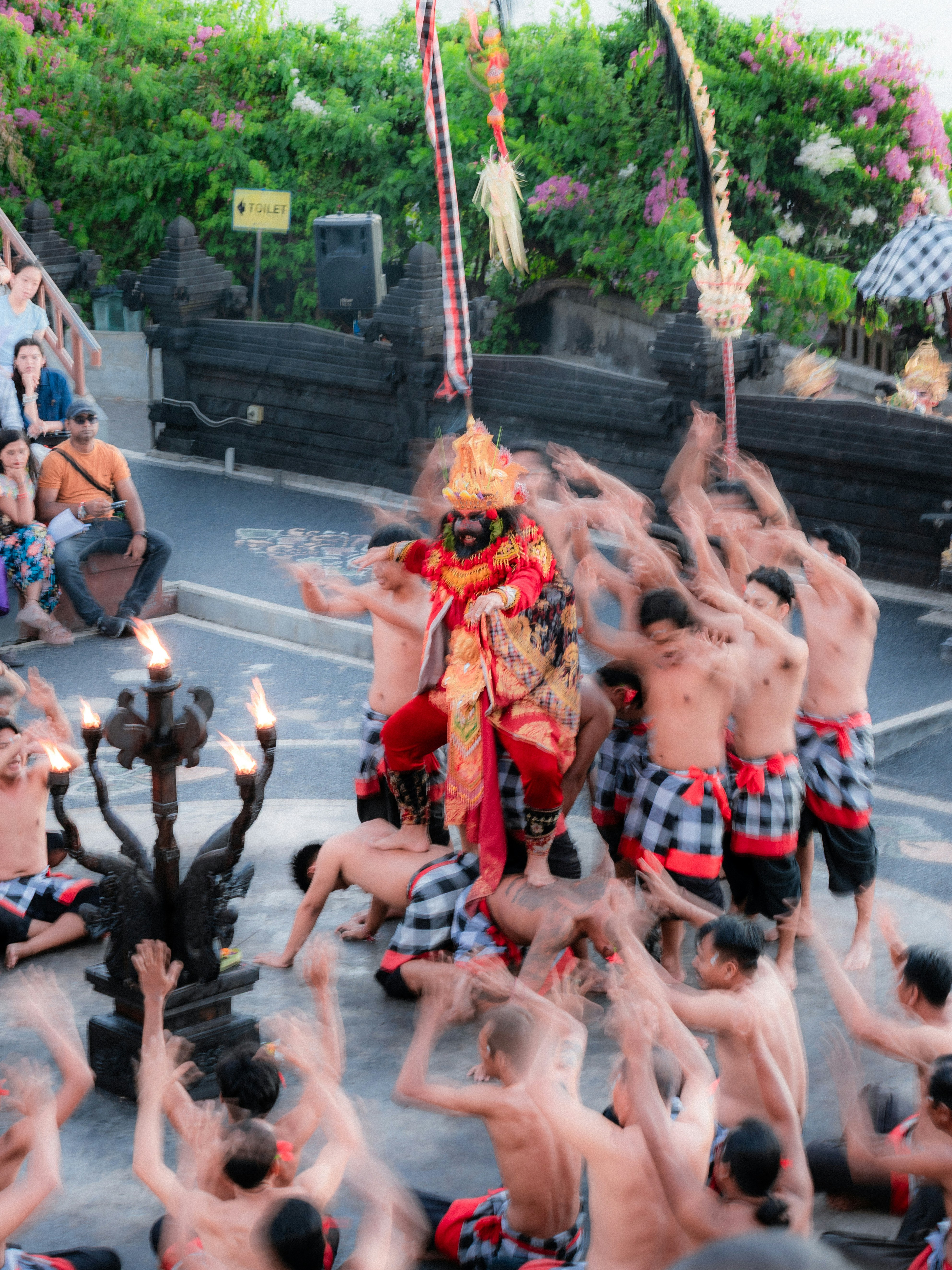 Dancers in traditional attire perform a ritual dance ritual.