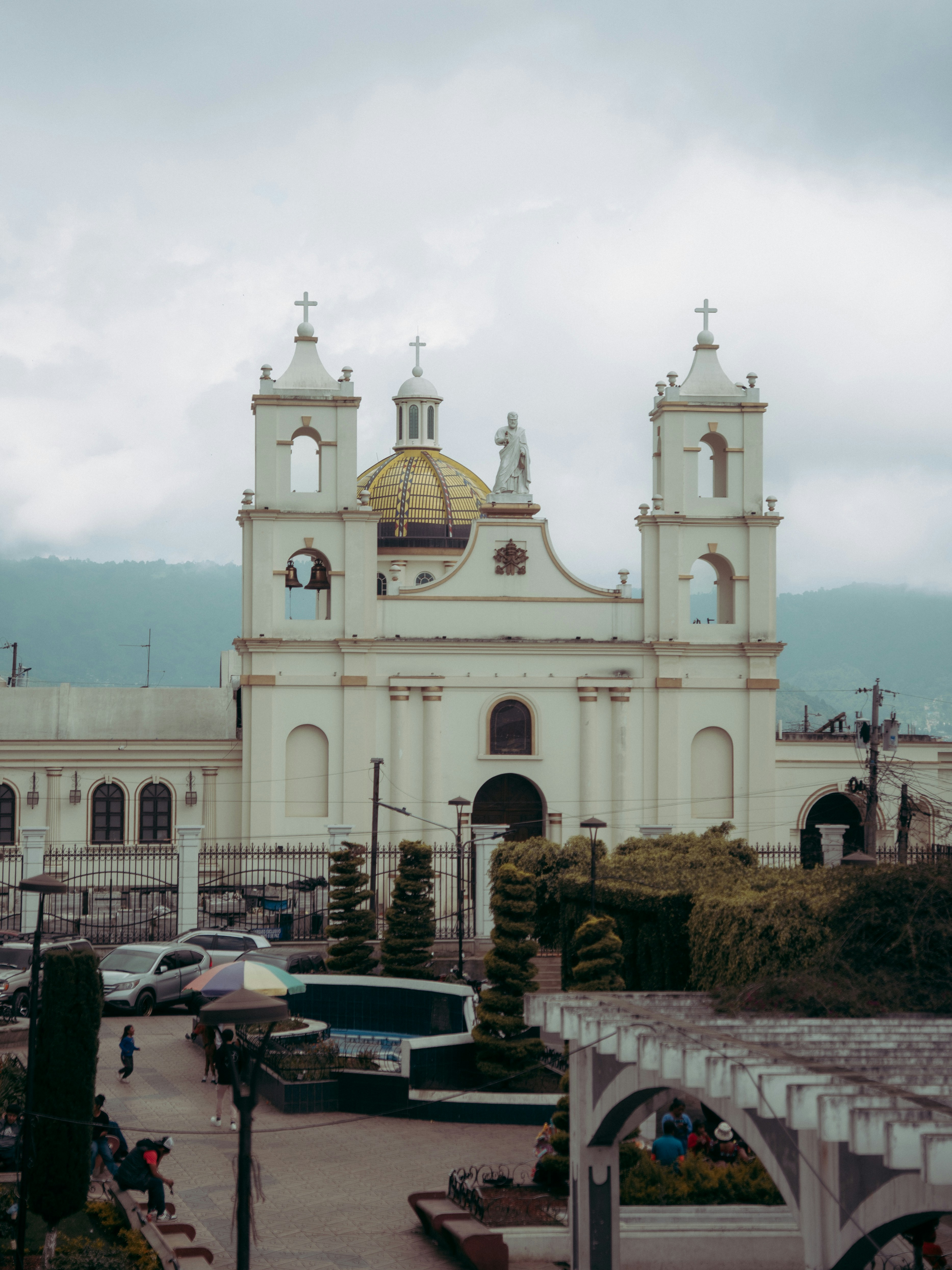 White church with golden dome and towers