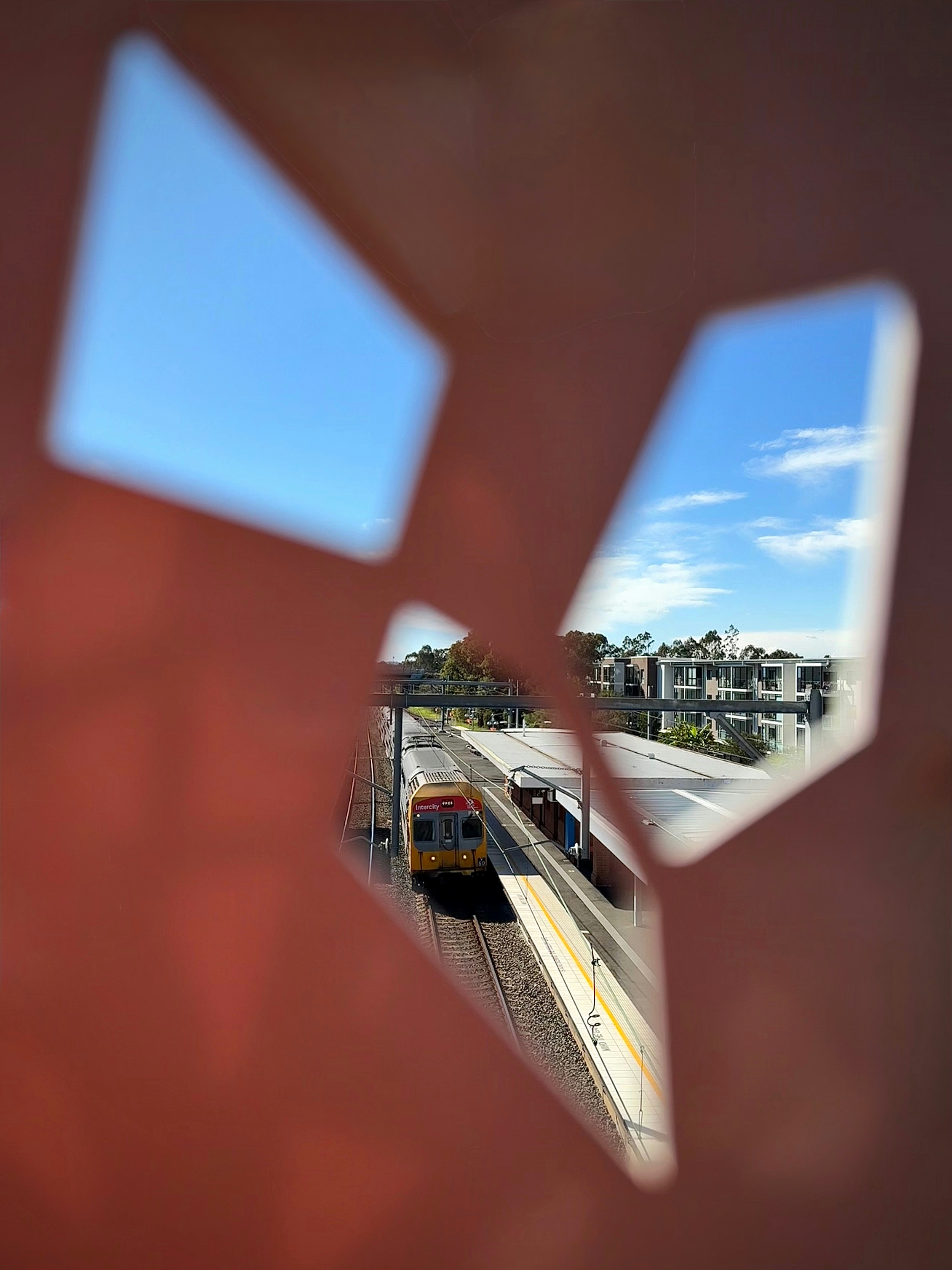 Framed Journey: A Train's Passage Through Urban Design