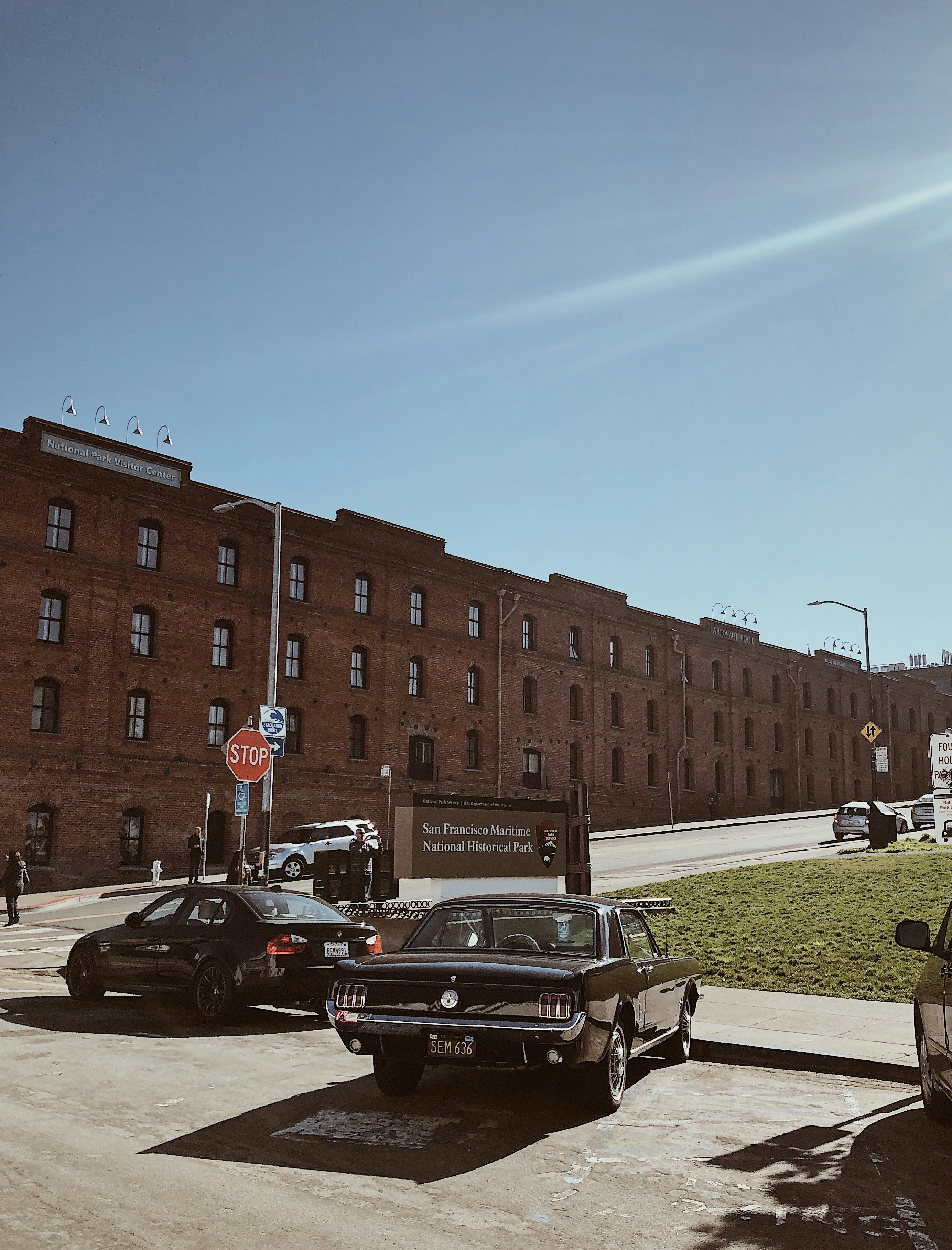 Processed with VSCO with a4 preset | Cars parked outside a historic brick building