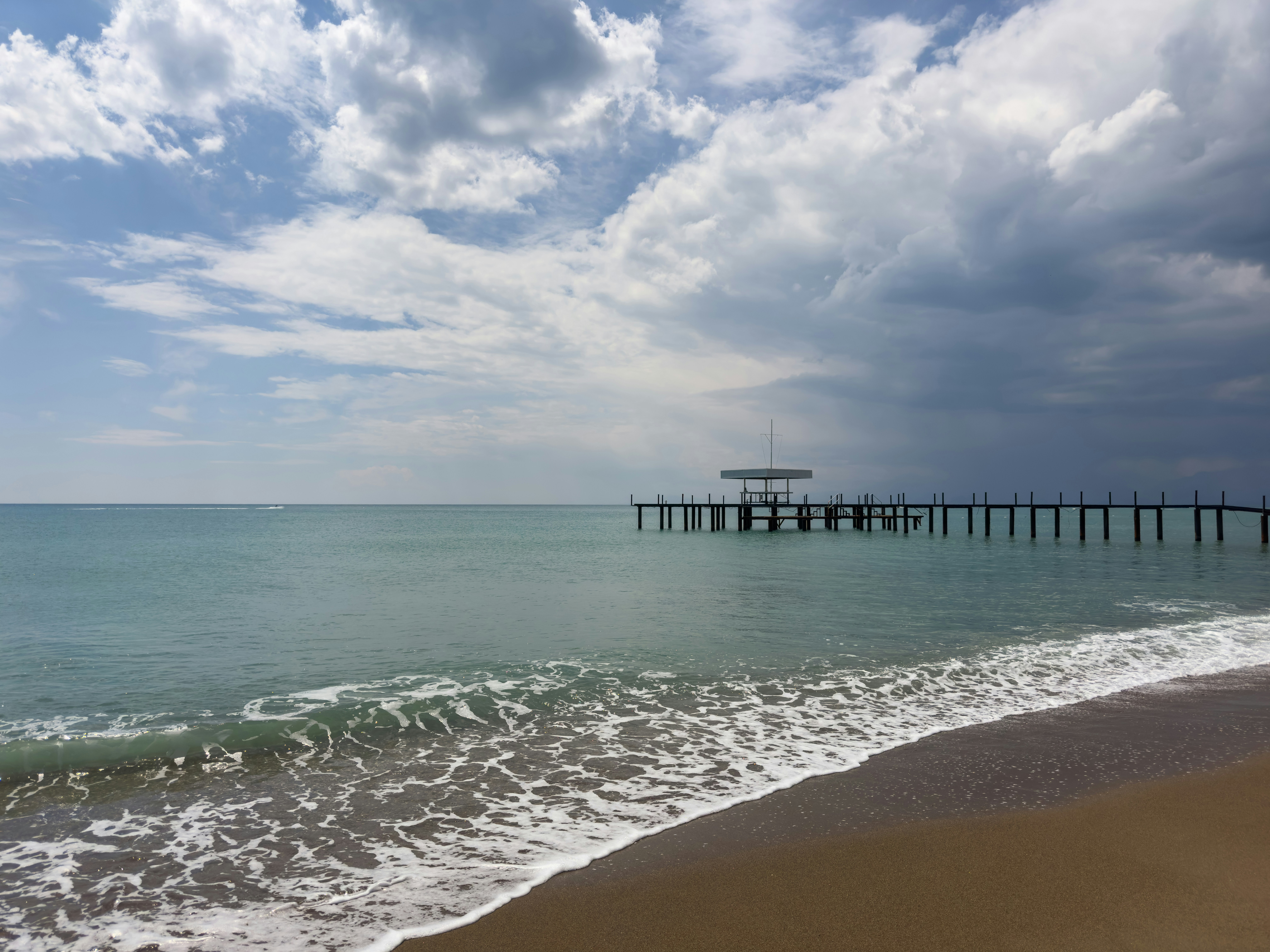 beautiful sea view and pier | Wooden pier extending over calm ocean water