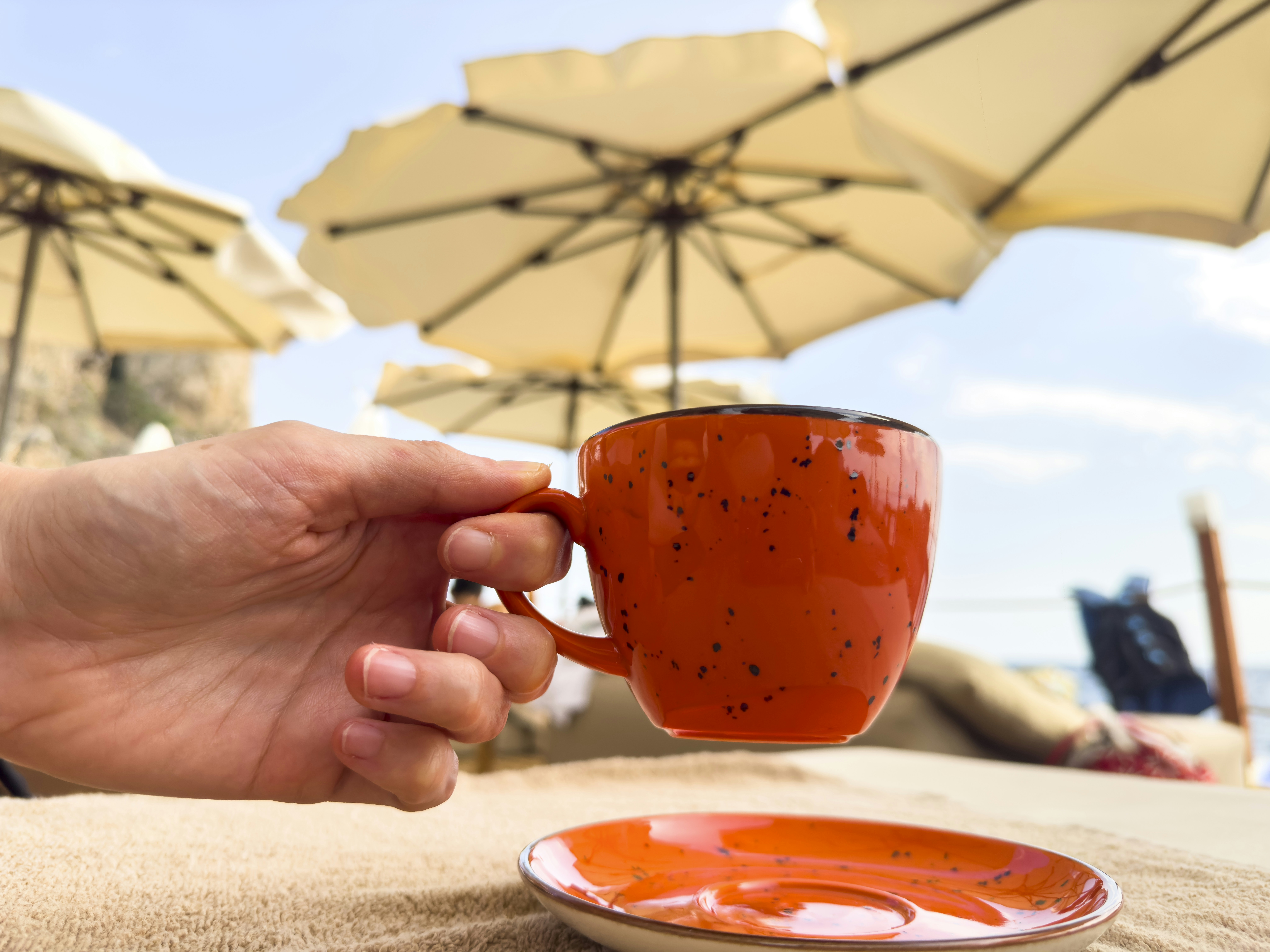 close-up of coffee by the sea