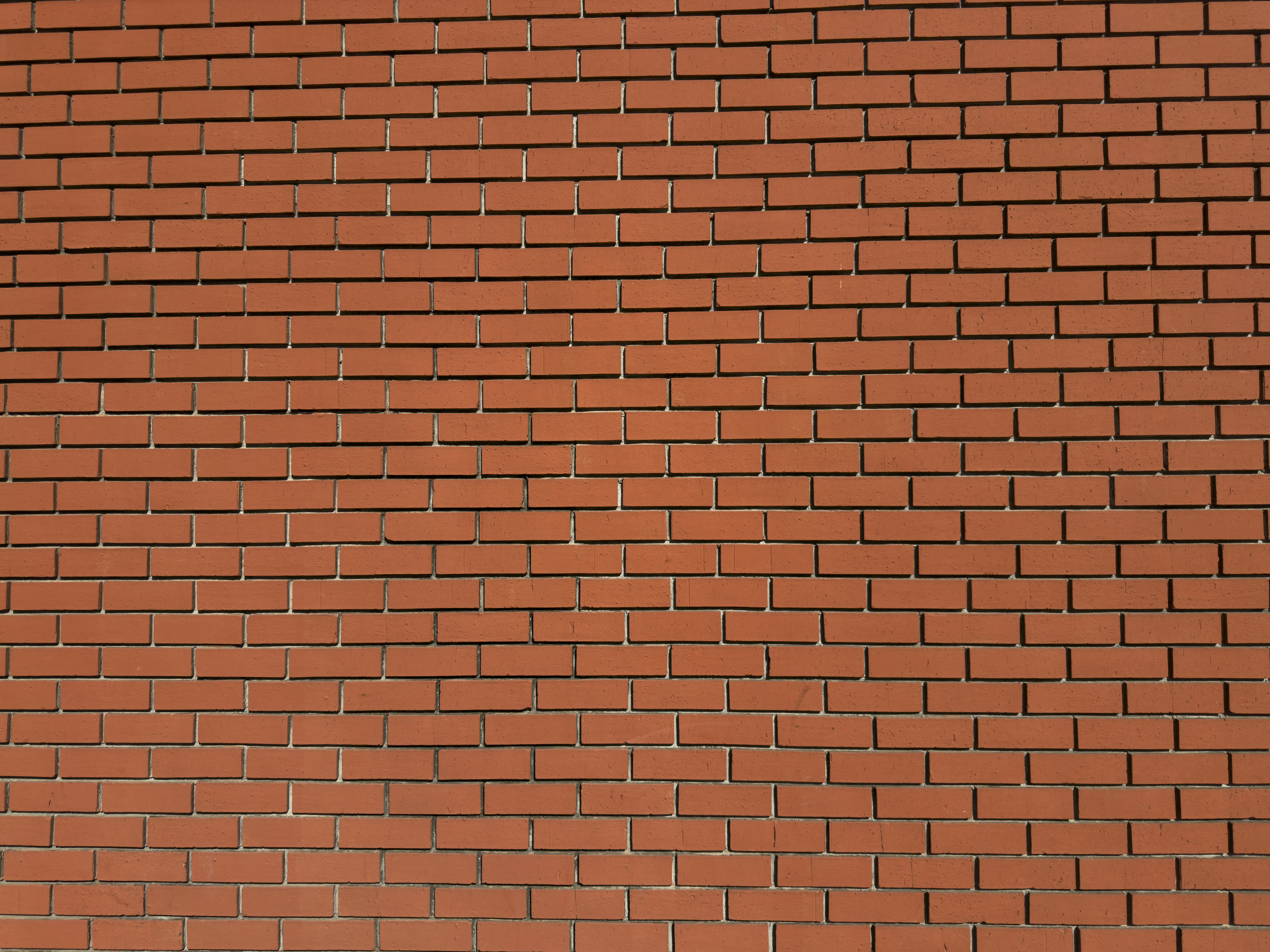 close-up of brick wall surface | A textured red brick wall background