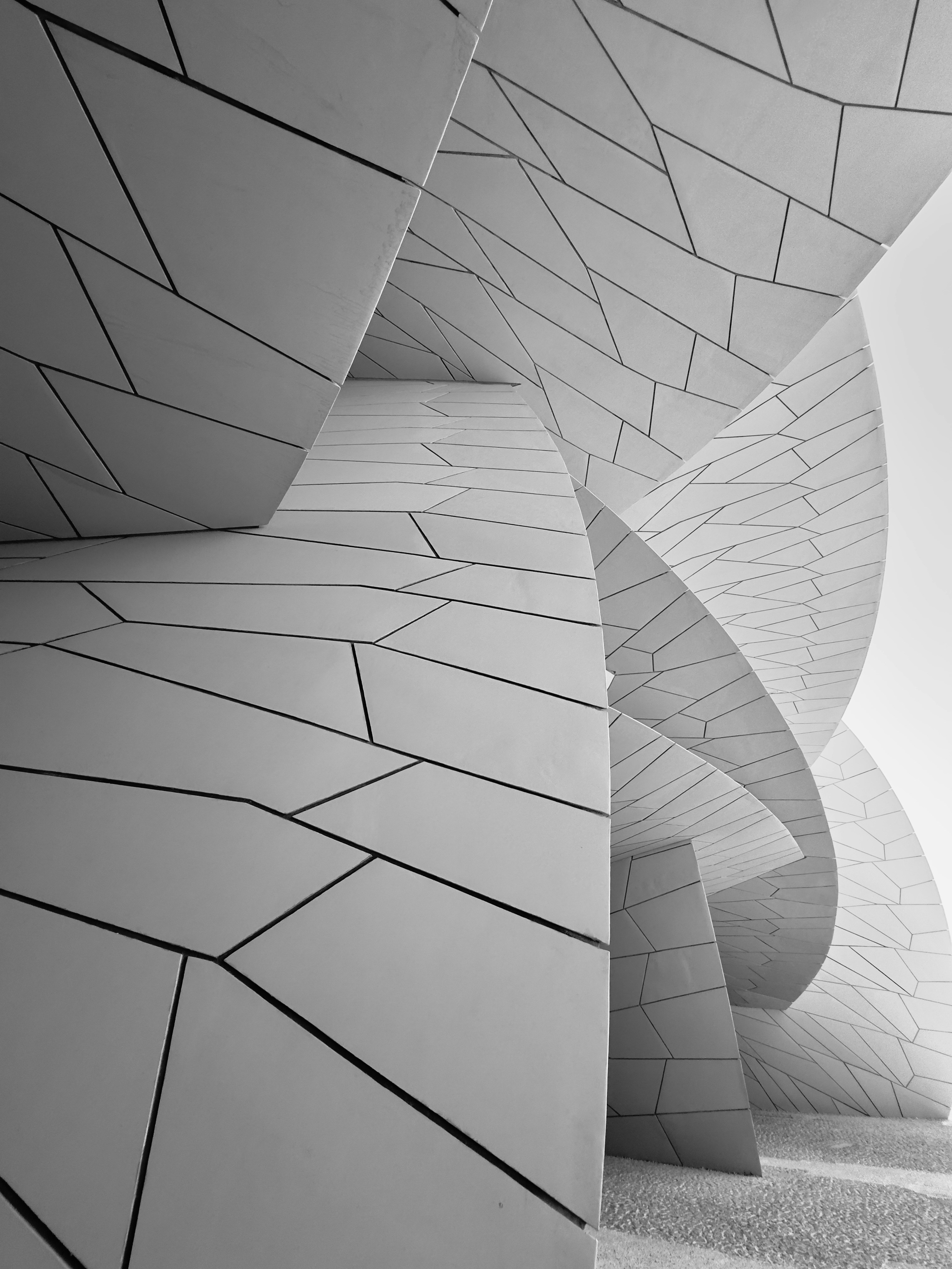 modern futuristic building close-up | Abstract geometric architectural design with curved surfaces