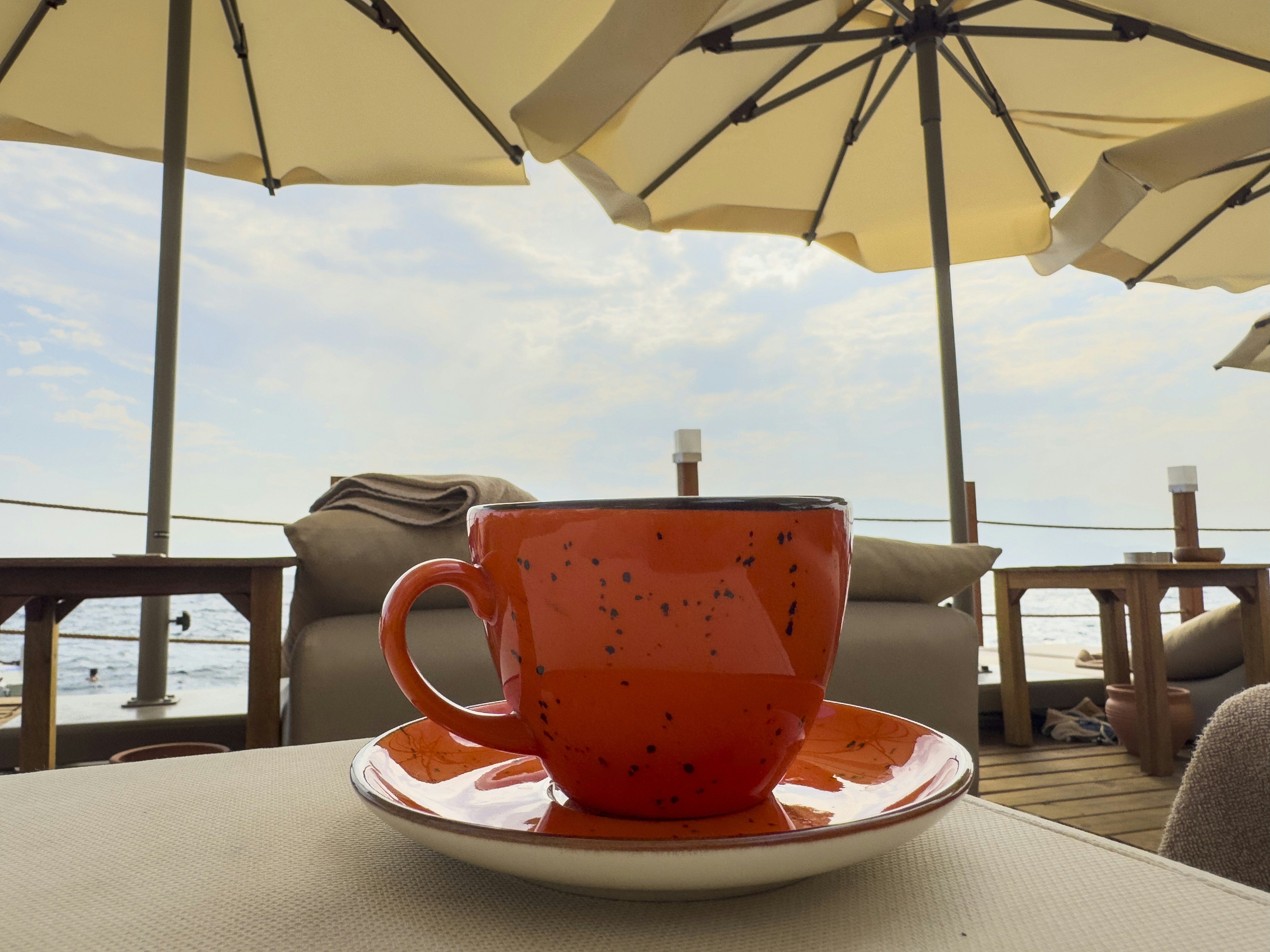 close-up of coffee by the sea