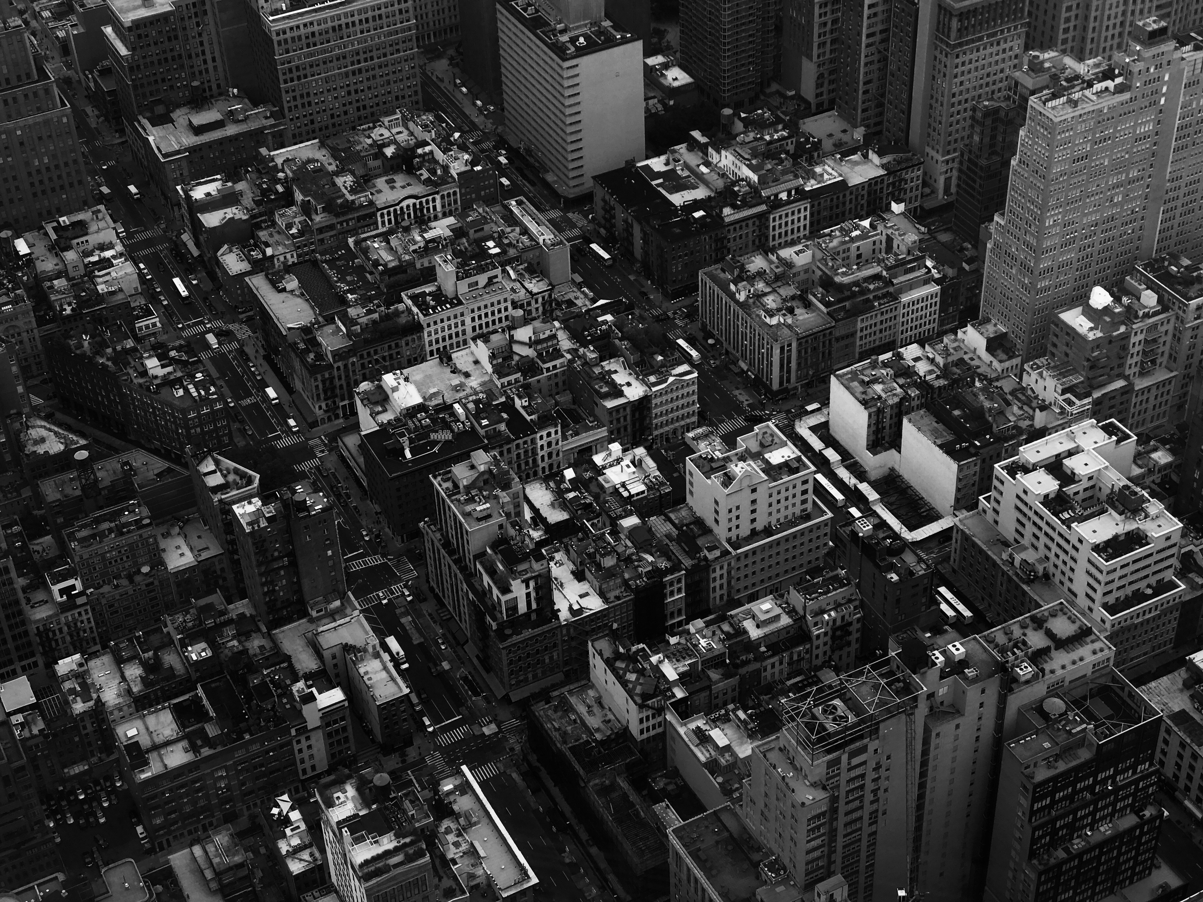 Aerial view of a dense cityscape with buildings.