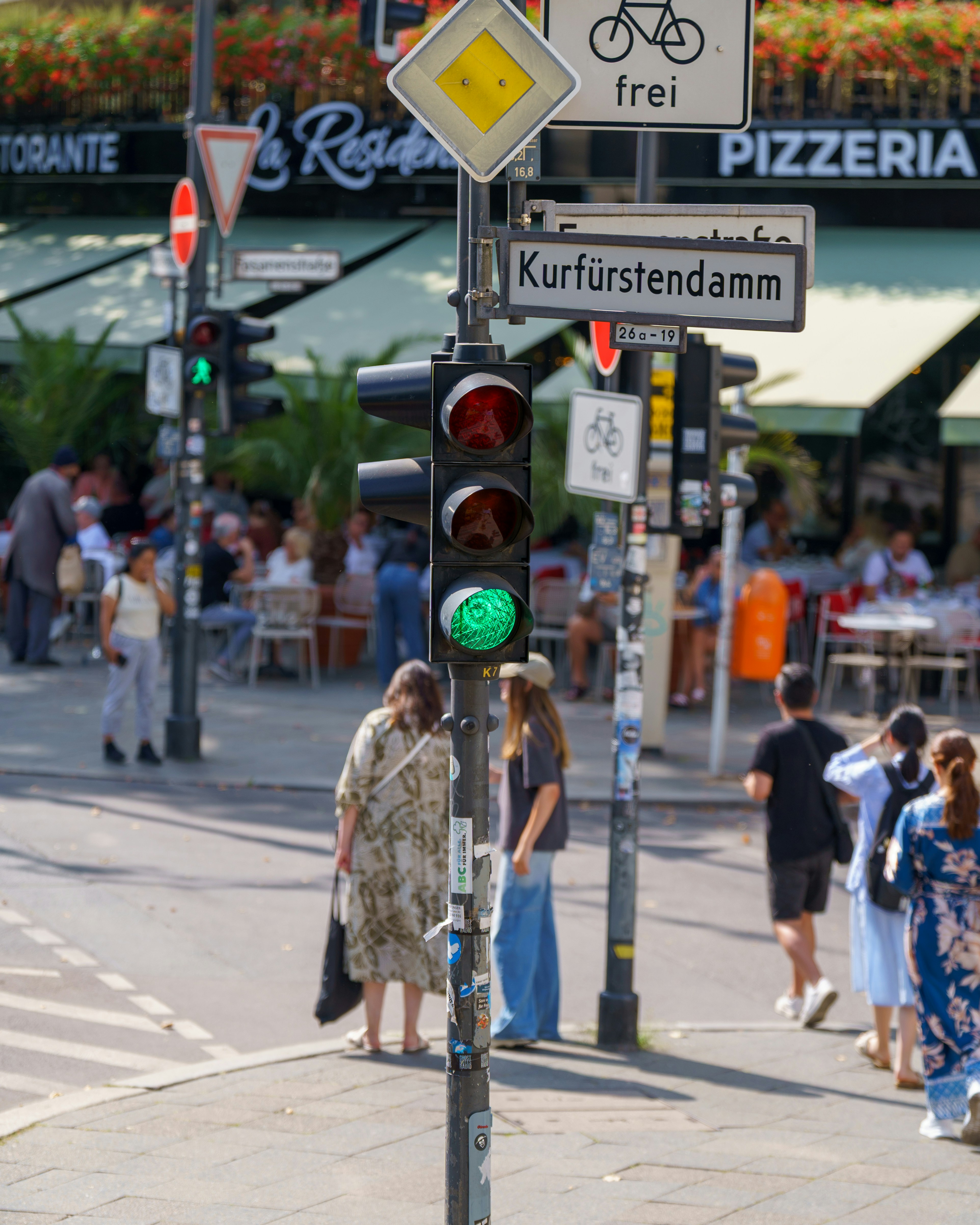 Crosswalk Signals and Streetlife Converge at Kurfürstendamm