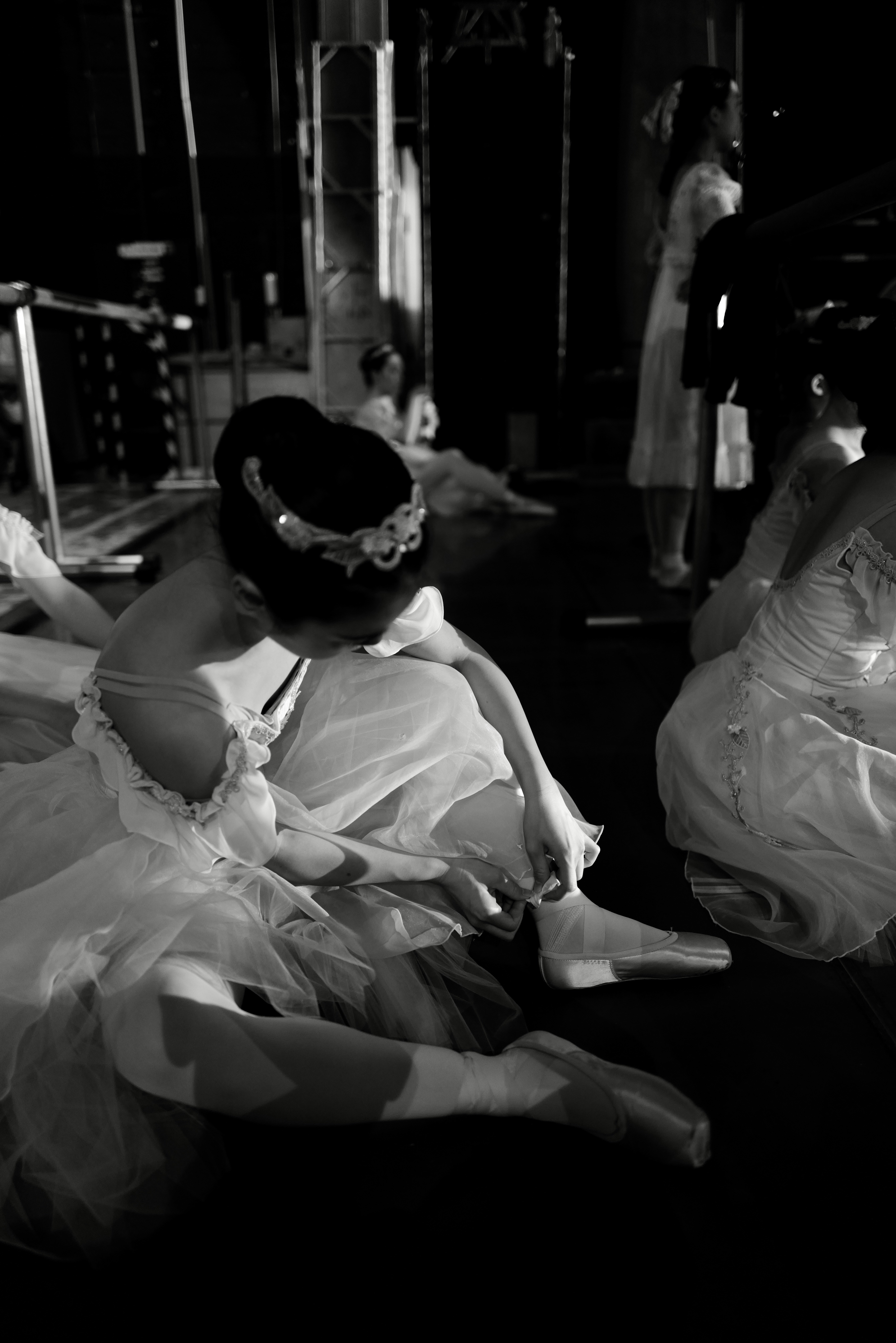 Ballerinas preparing backstage before a performance.