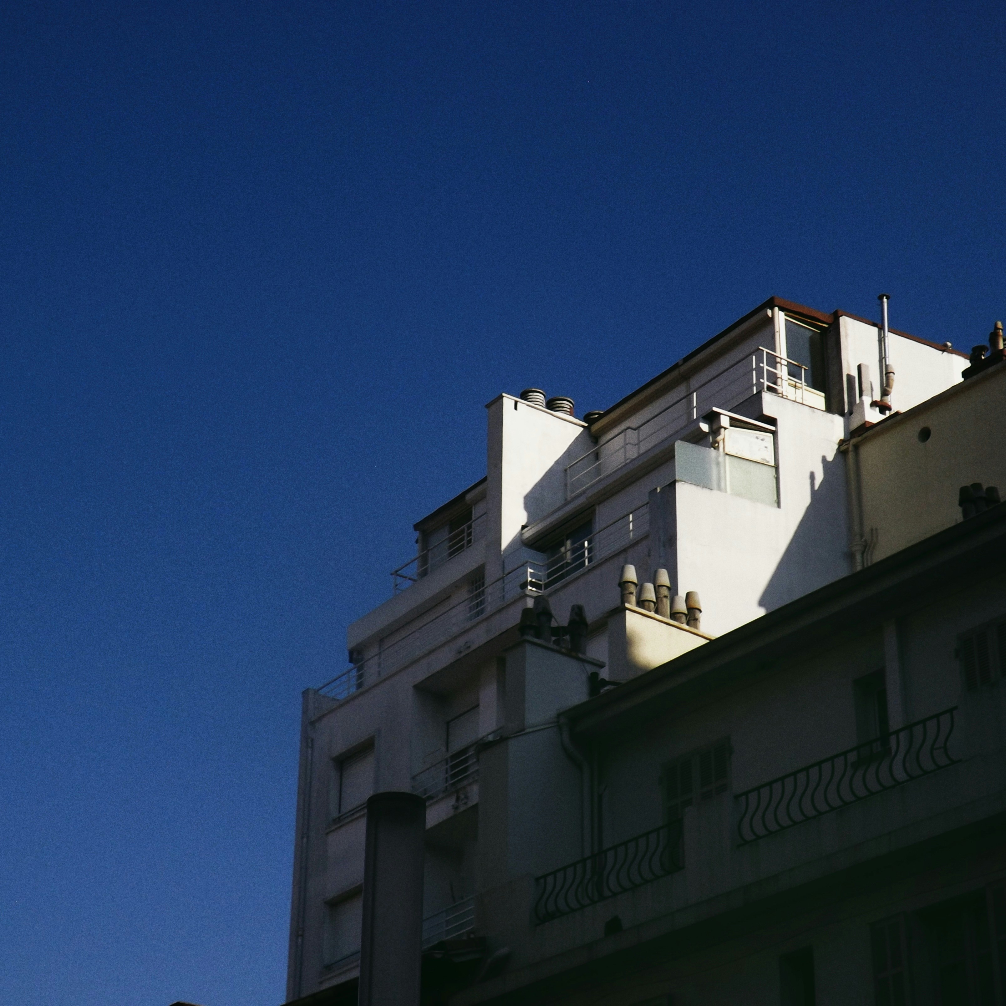 White buildings against a clear blue sky