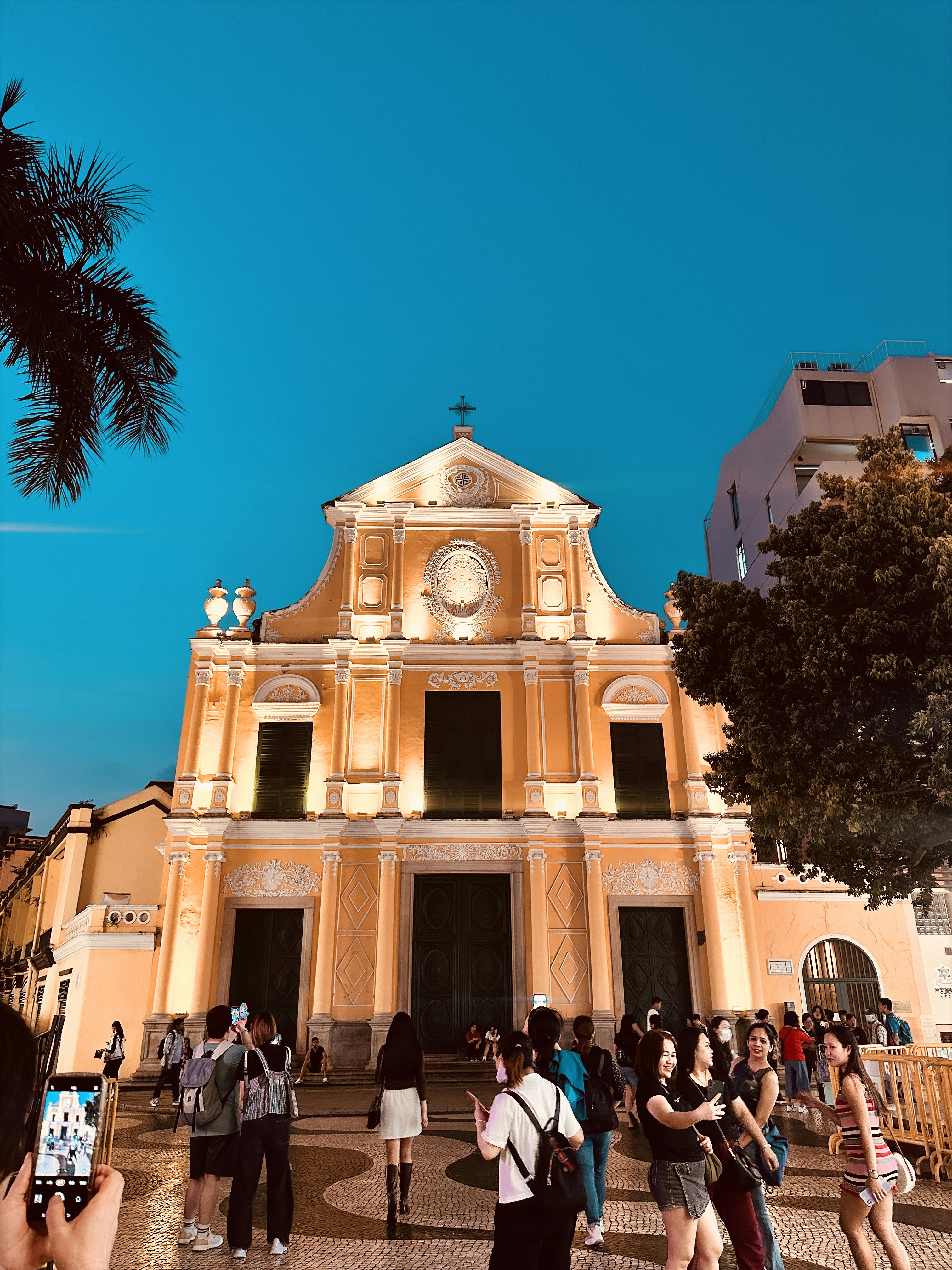 Around Macau St. Dominic's Church at night. 澳門玫瑰堂一帶 | Historic yellow church facade with people gathered