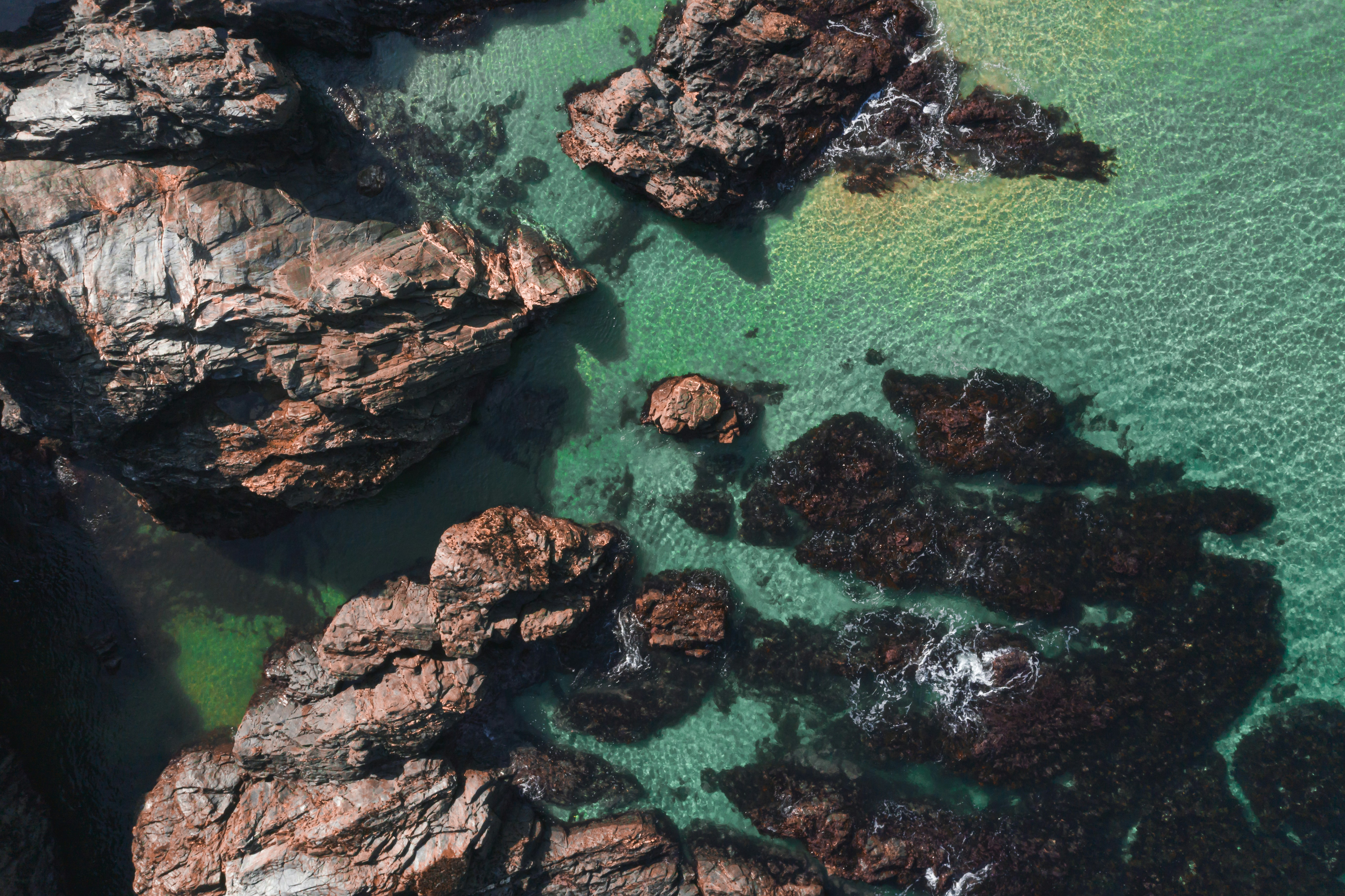 Fancy a dip, Cornwall from Above | Rocky coastline with clear turquoise water