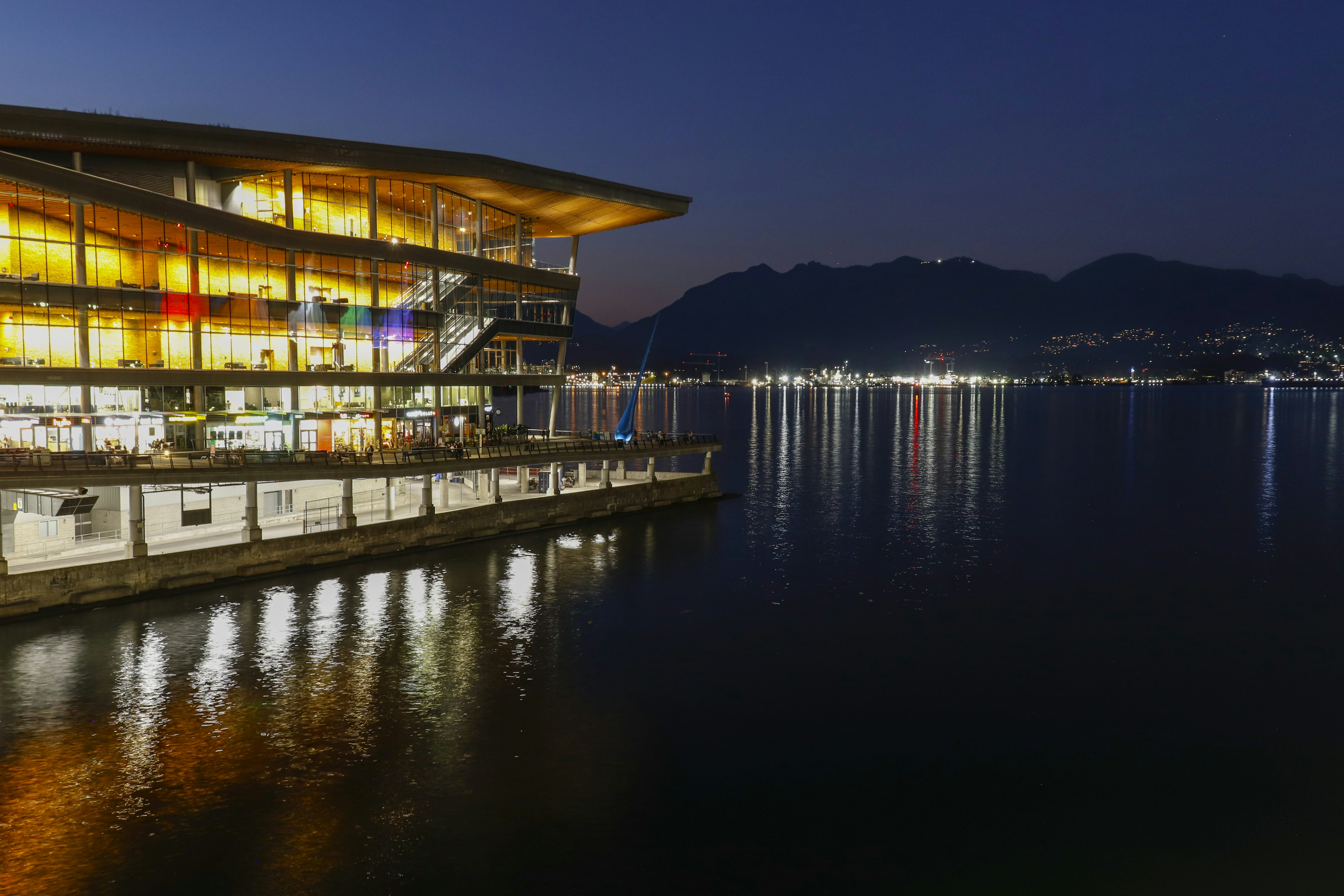 Luminous Waterside Architecture at Dusk