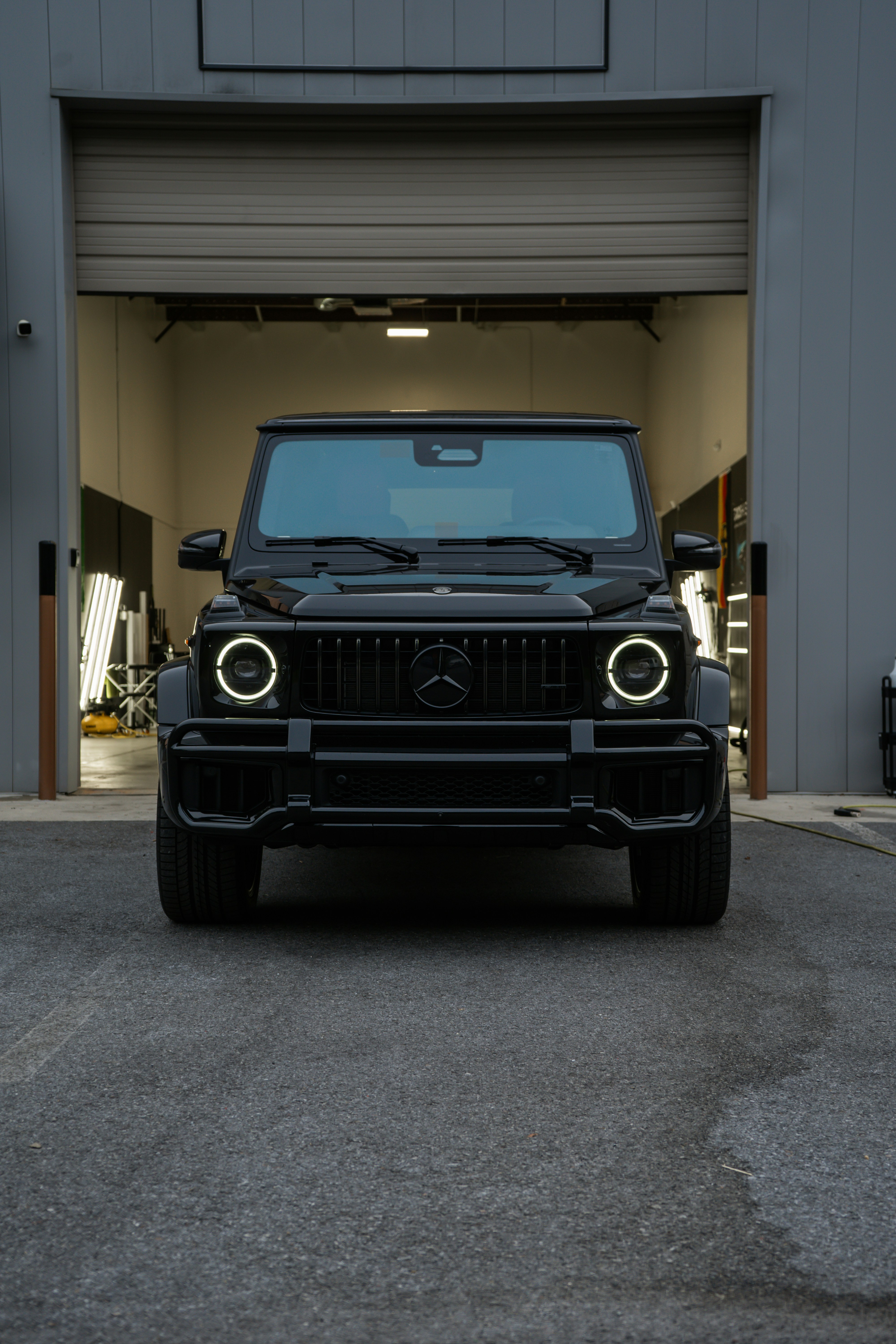 Black mercedes g-wagon parked in front of garage photo – Free Car Image ...