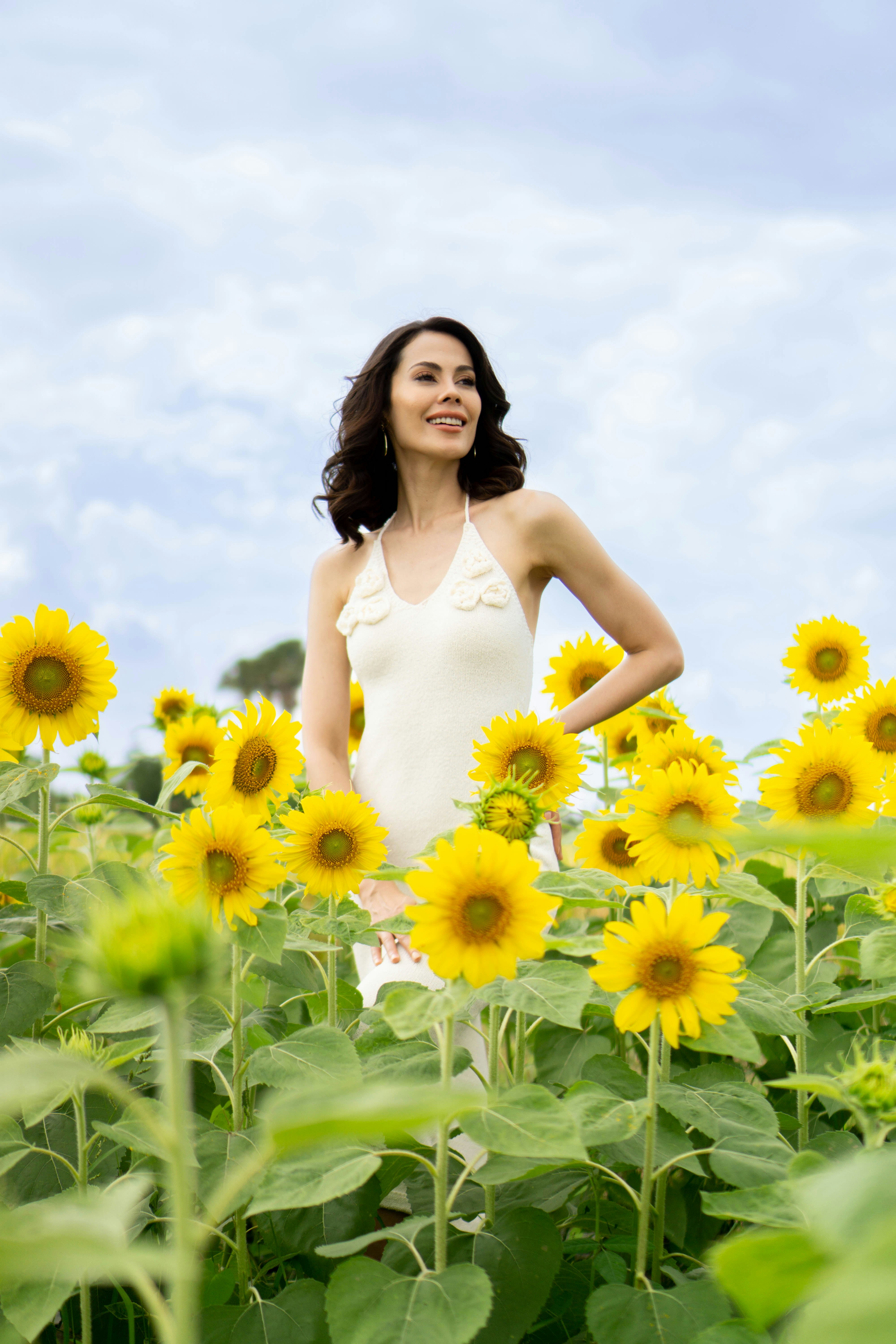 Sunlit Confidence: Woman Among Sunflowers