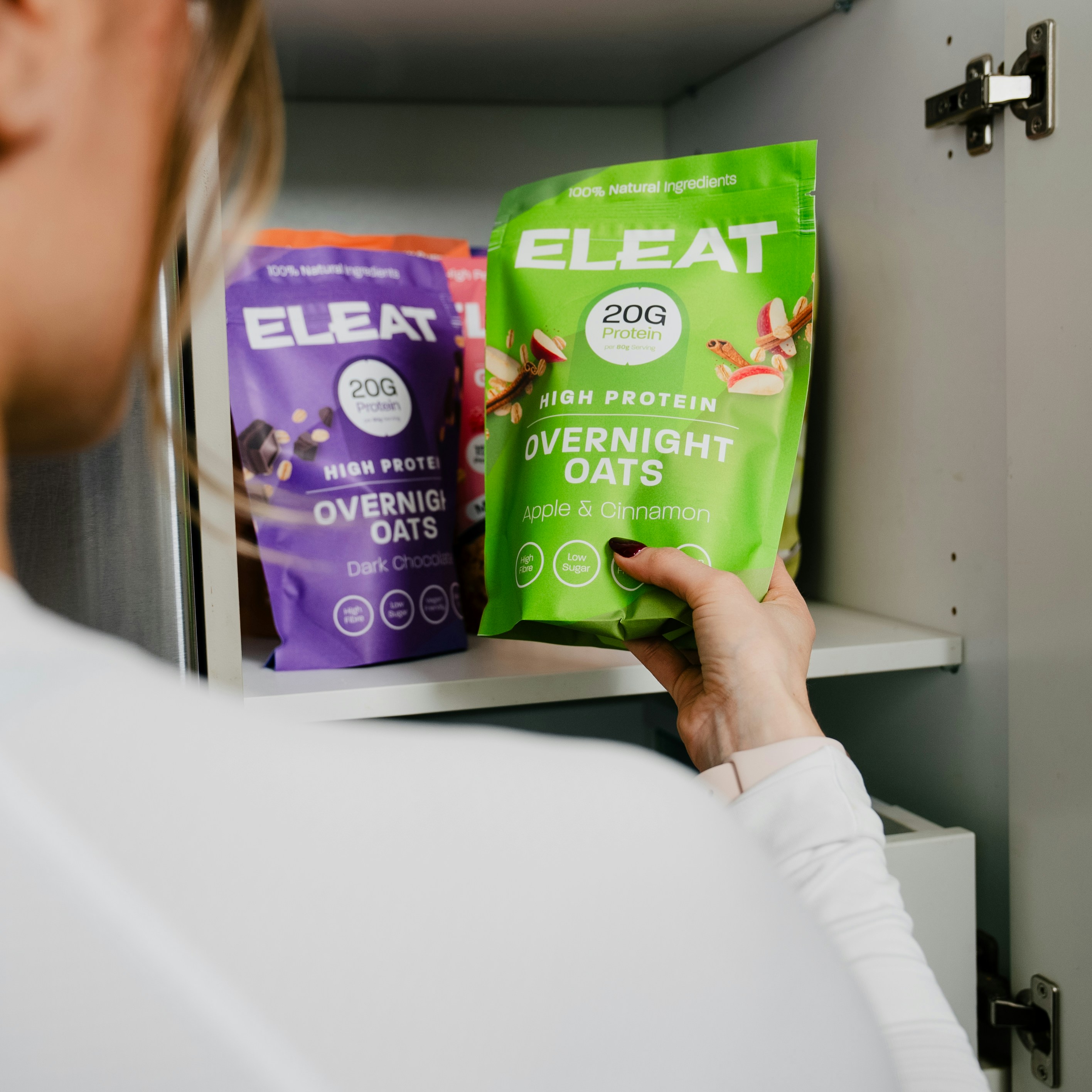 Hands Reach for Night-Protein Oats: A Snack-Time Ritual