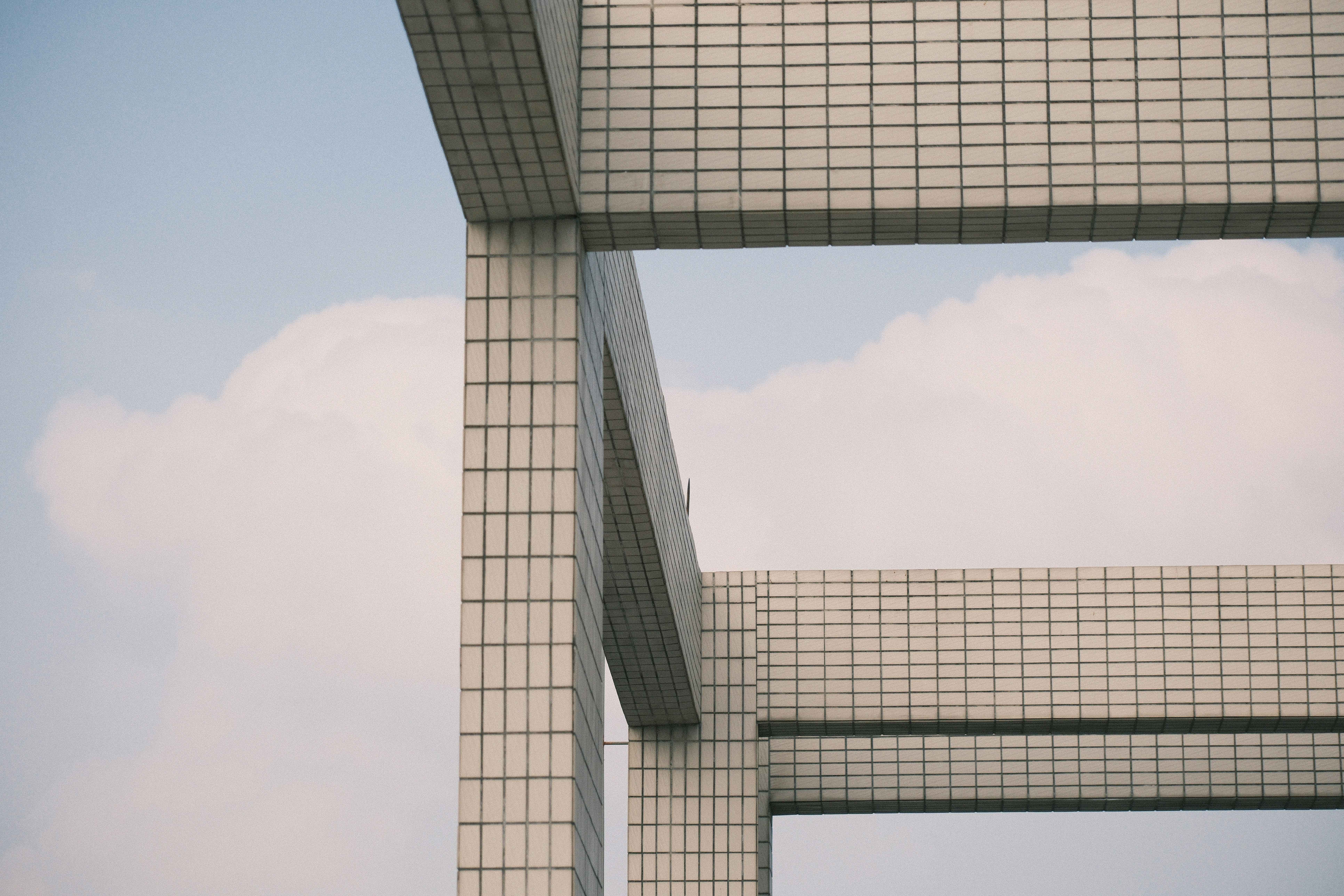 Modern building structure against a cloudy sky