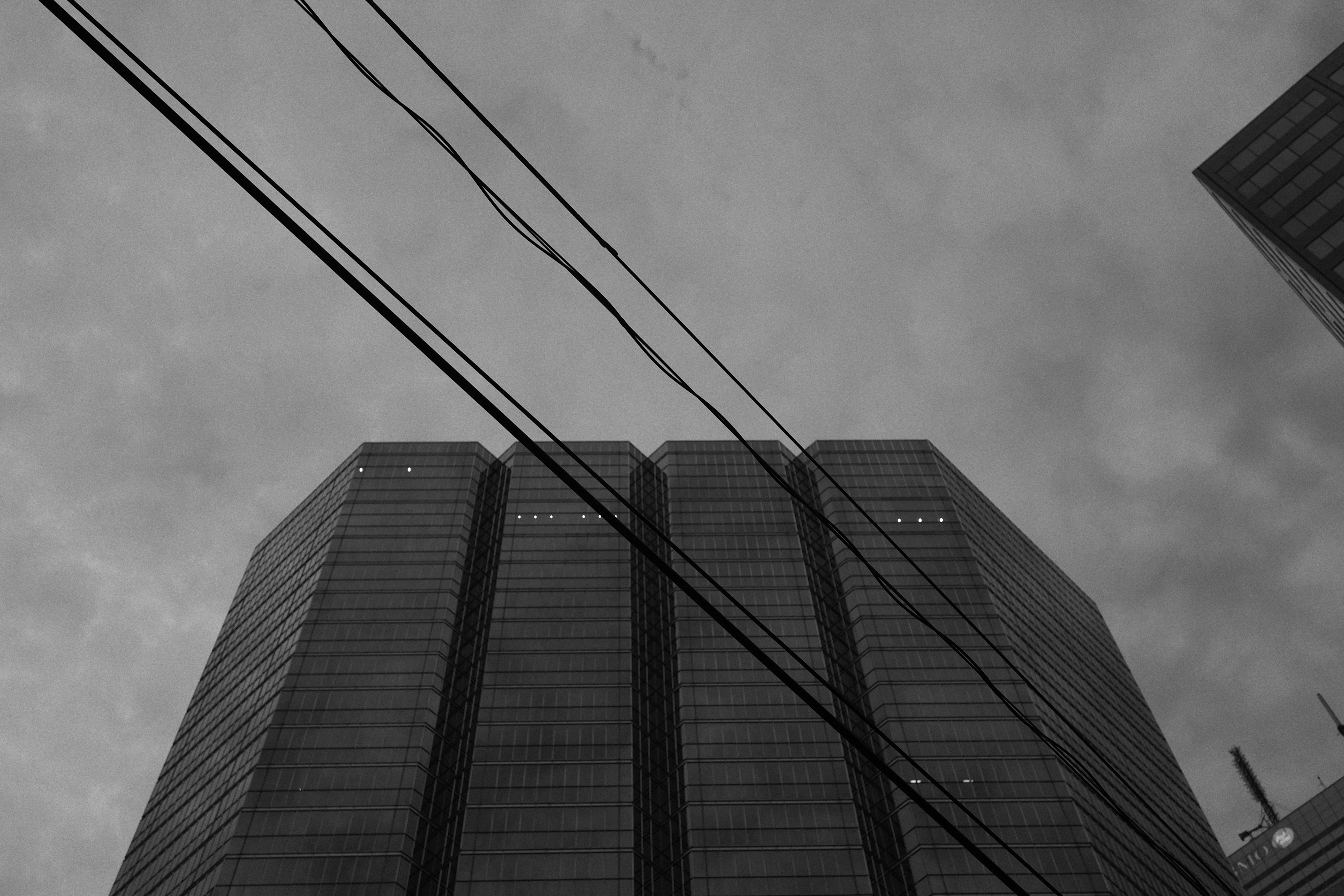 Modern skyscraper against a cloudy sky