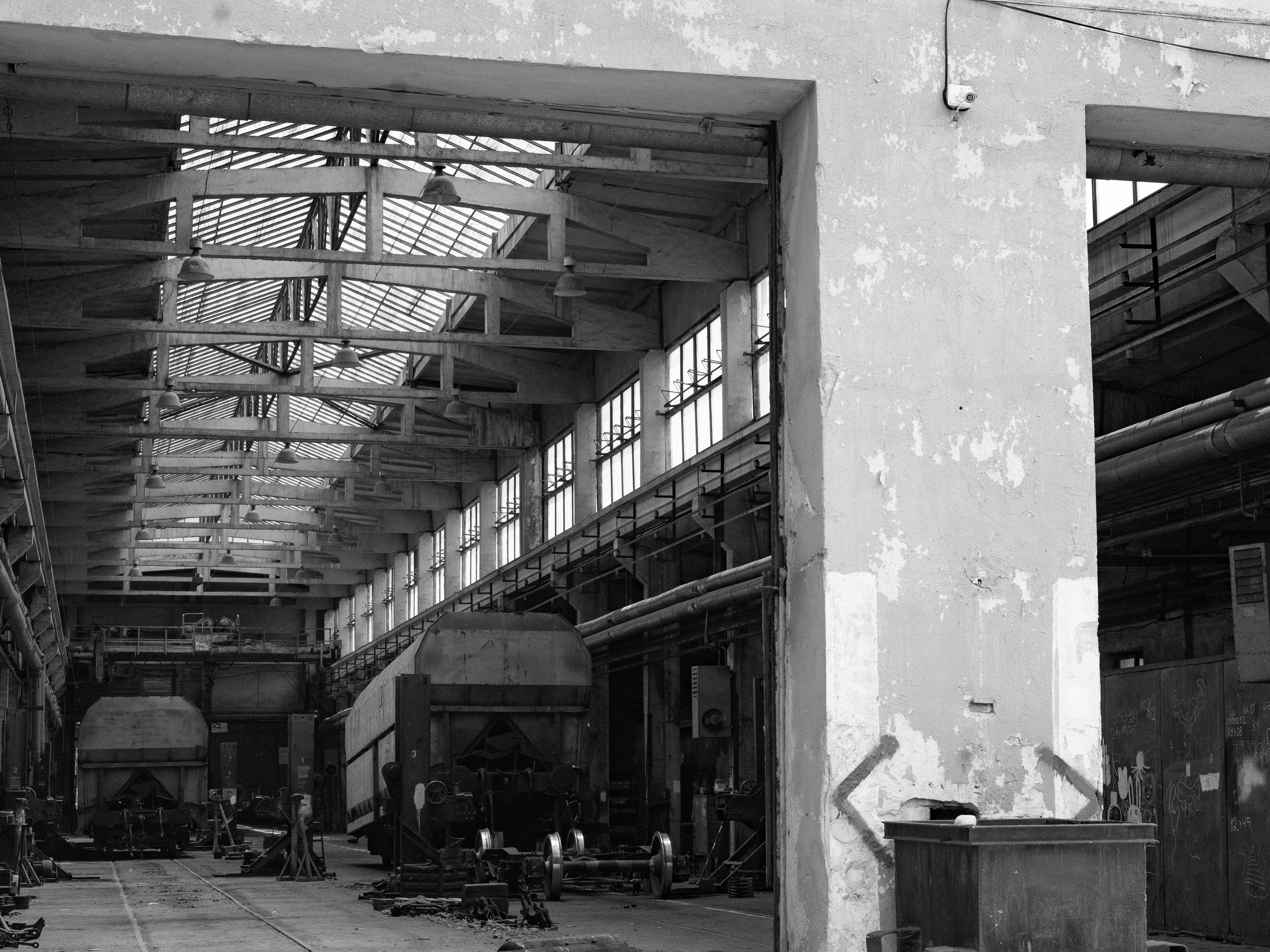 Old train workshop with natural light from windows.