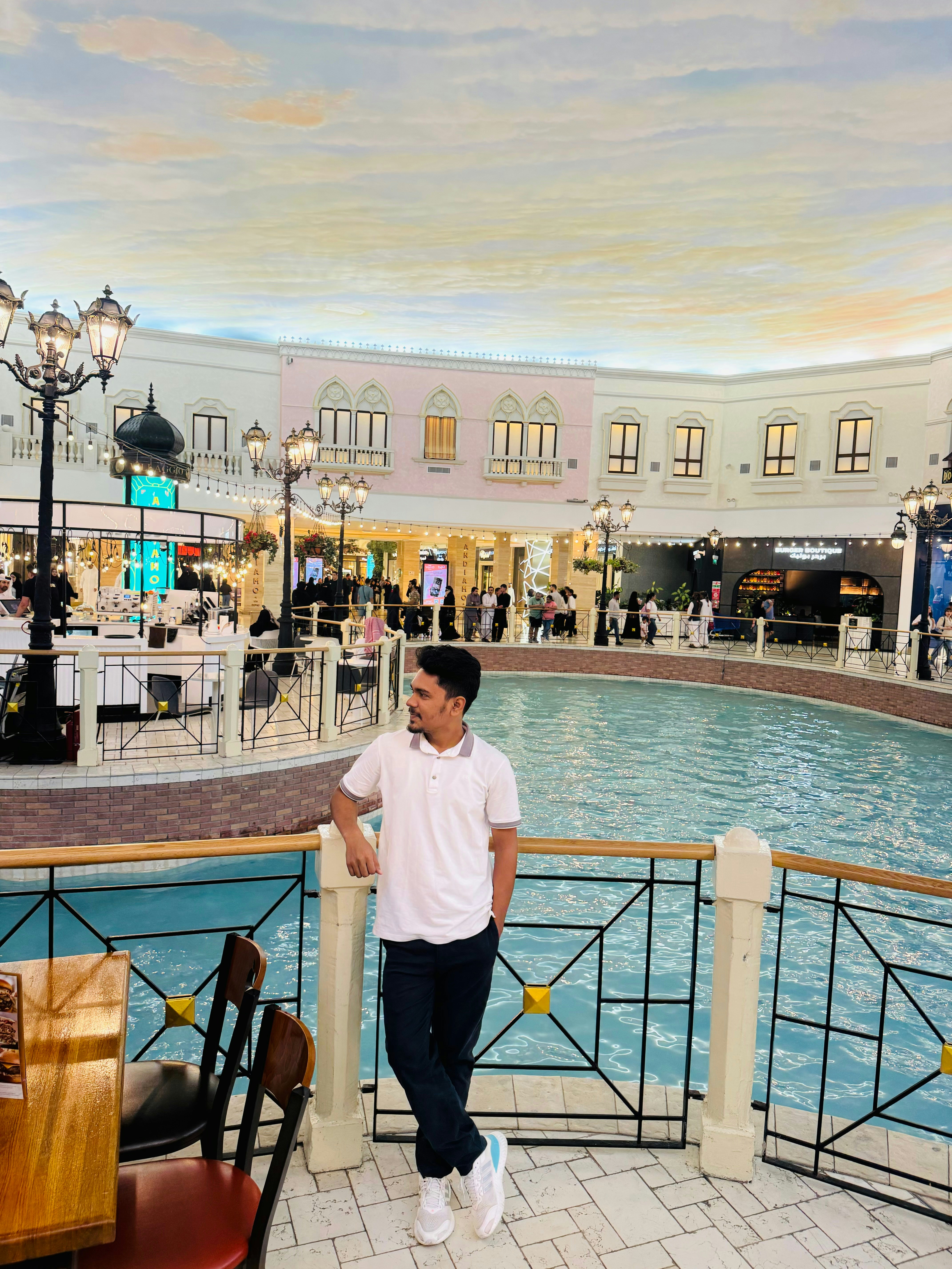 Canal-Side Portrait at Dusk in a Luxe Shopping Piazza