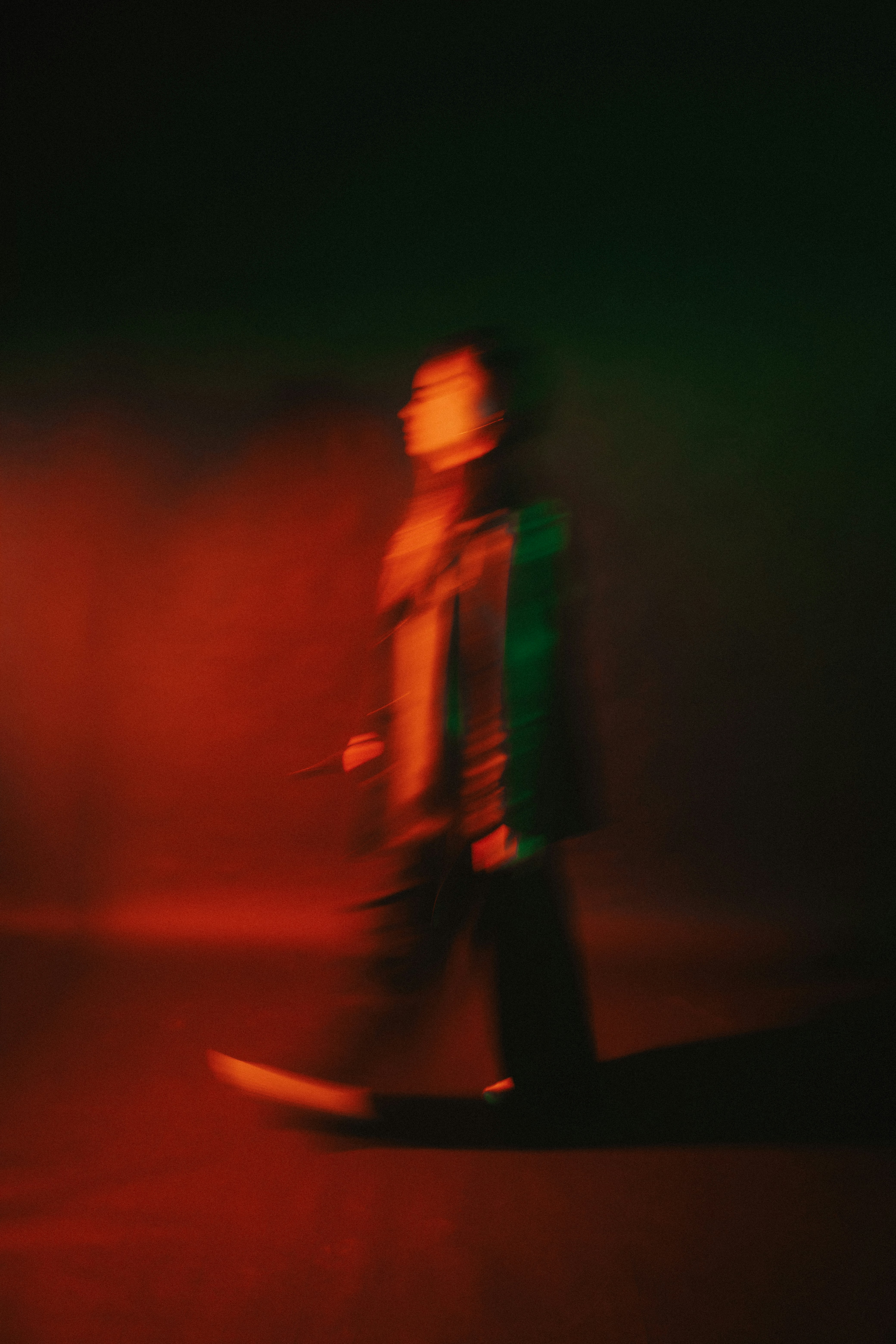 Person walking in red and green light