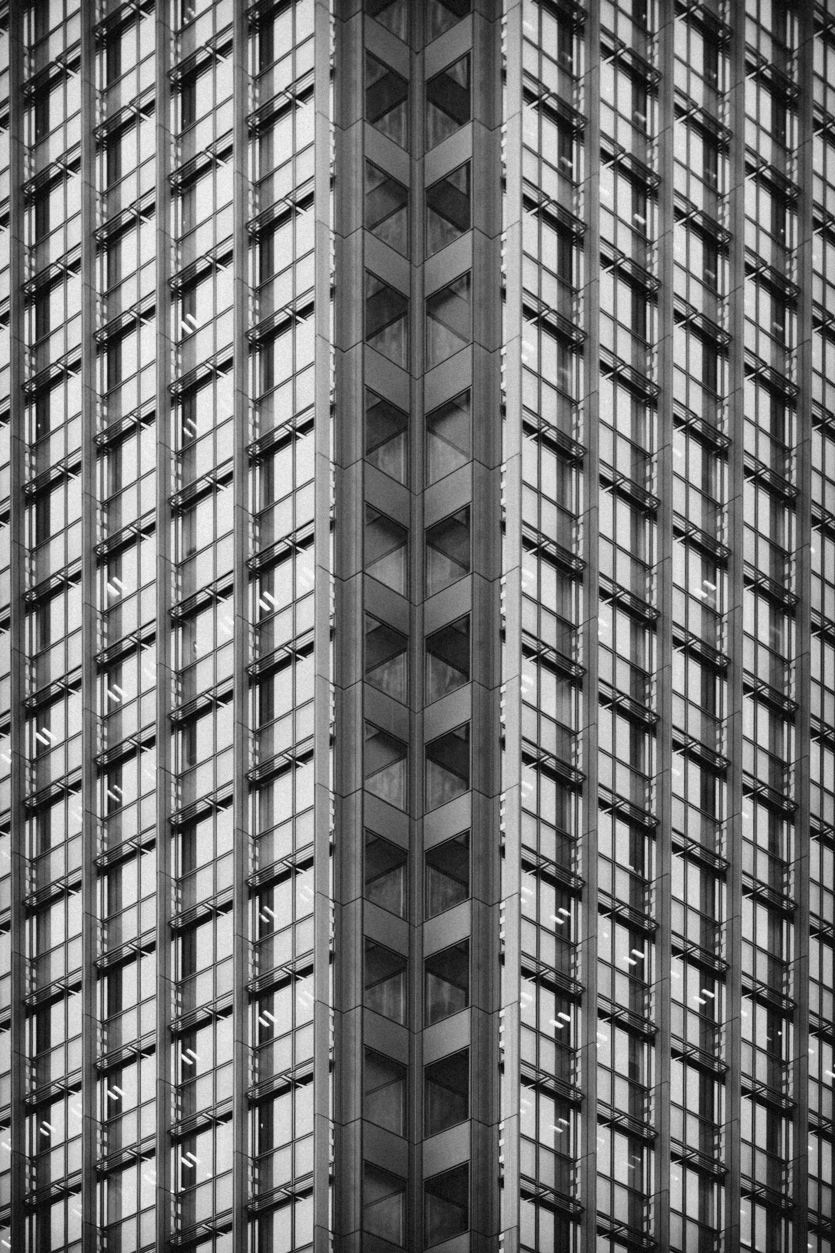 Modern skyscraper facade with repeating glass windows