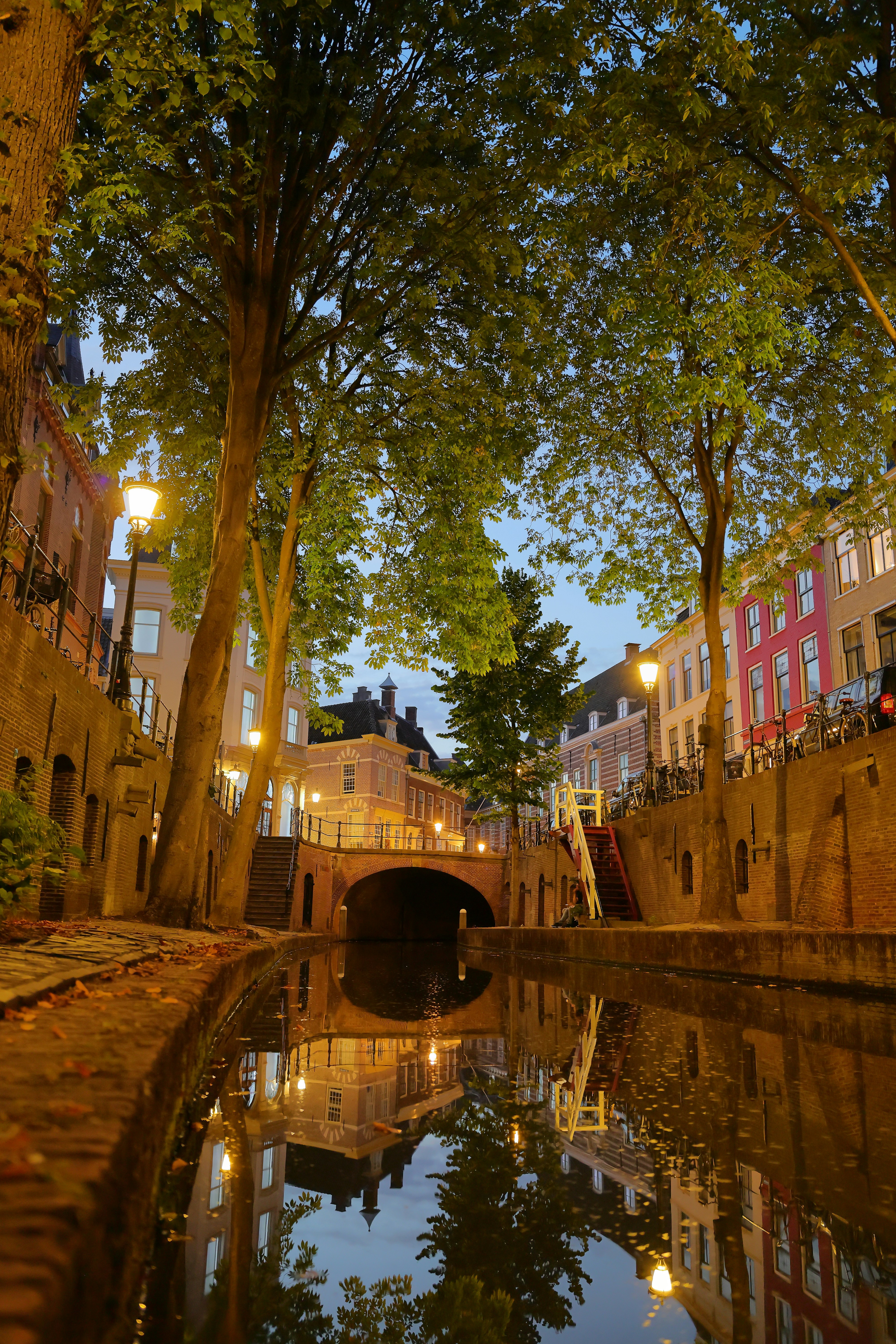 Canal in a european city at dusk with reflections