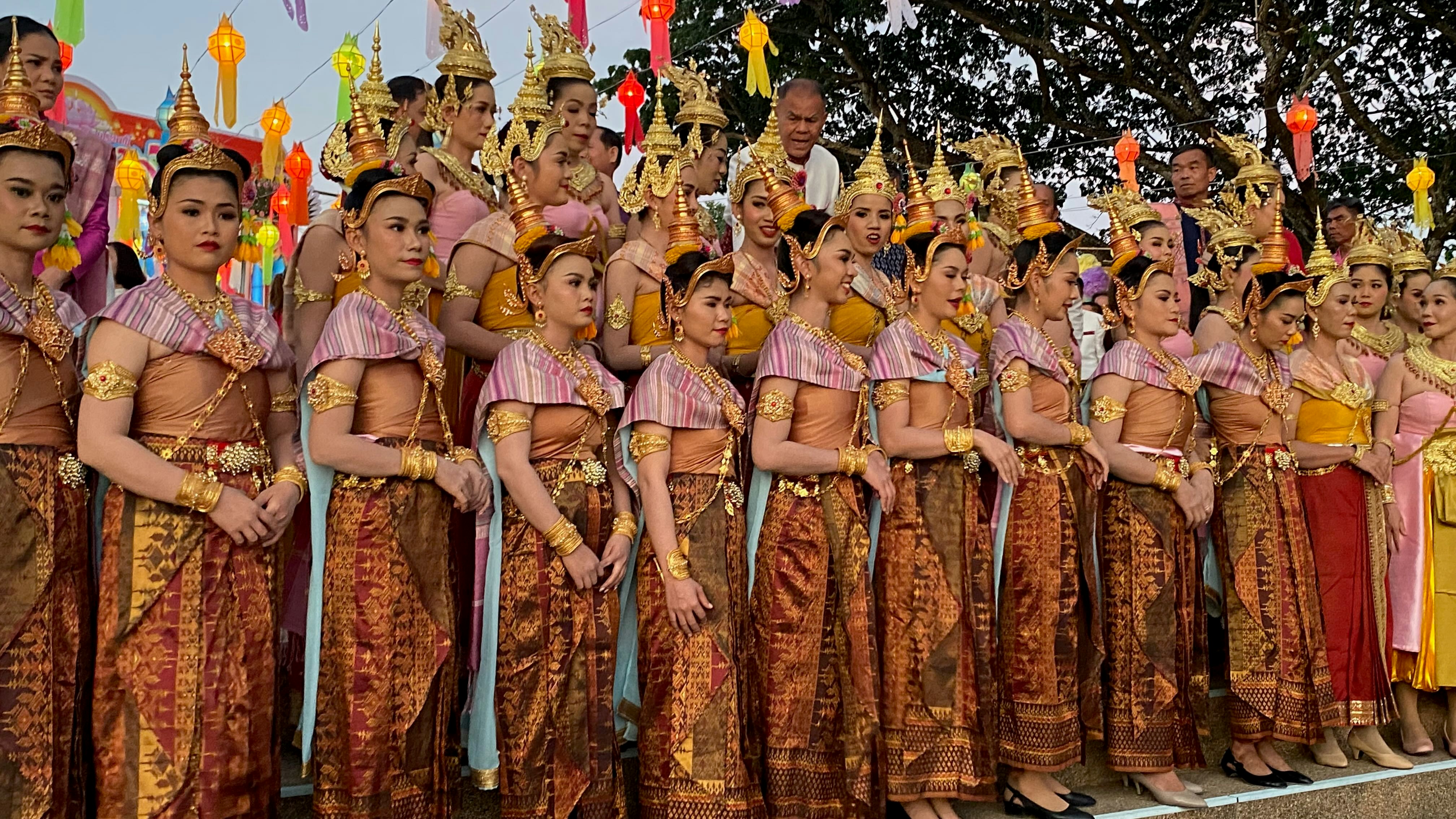 Children in traditional thai costumes at a festival