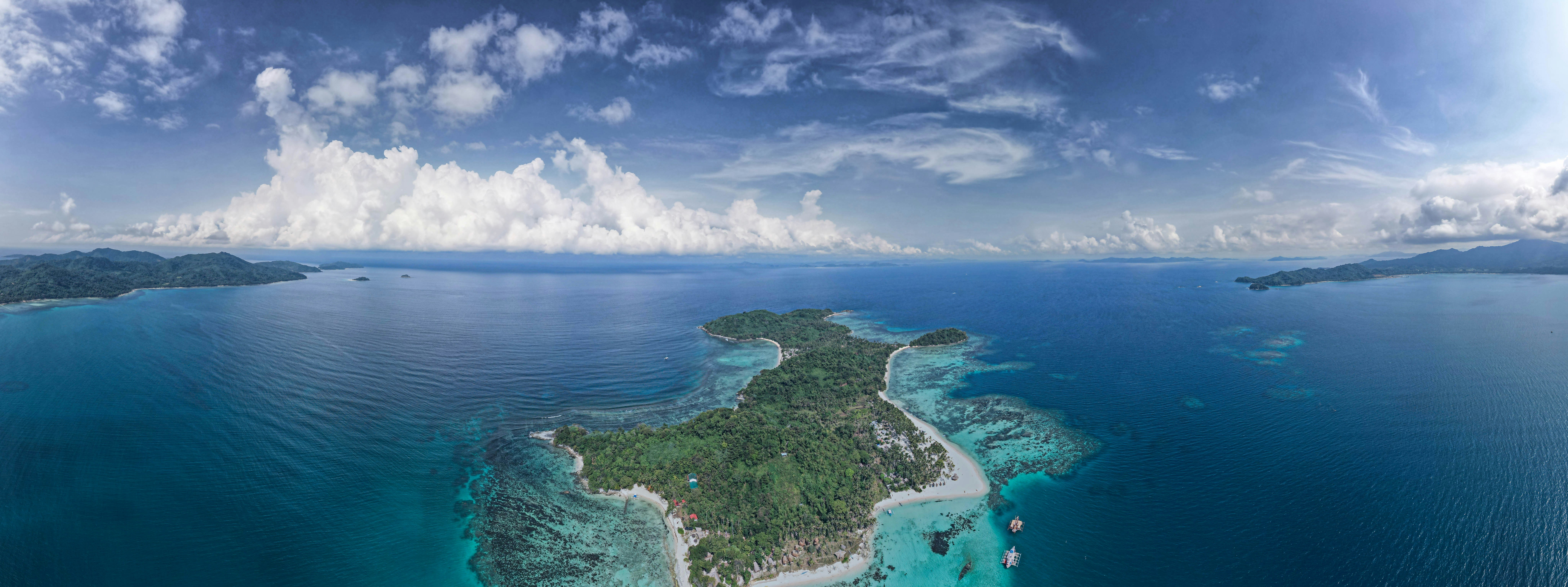 Tropical island with turquoise water and blue sky