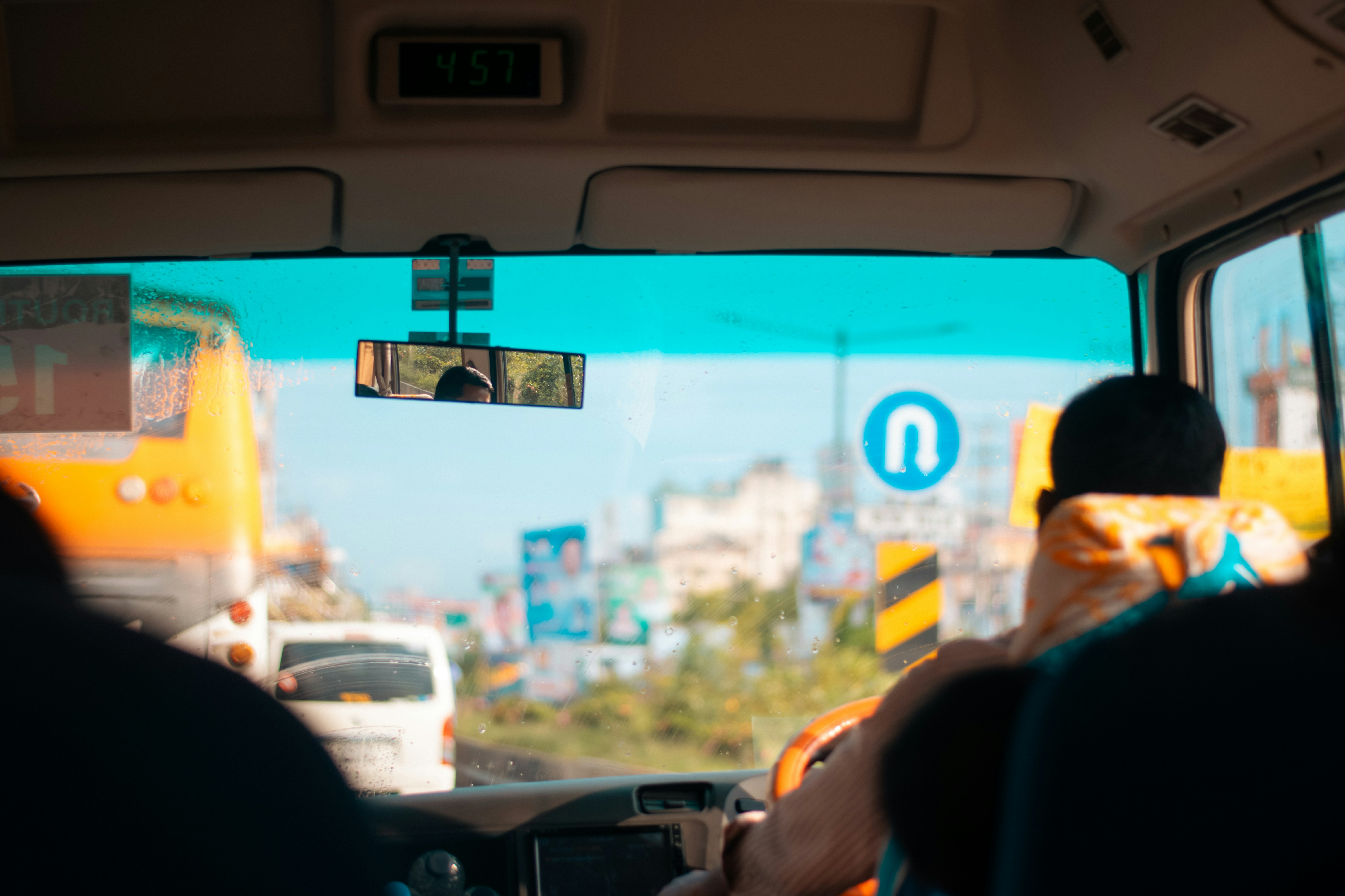View from car with traffic and buildings