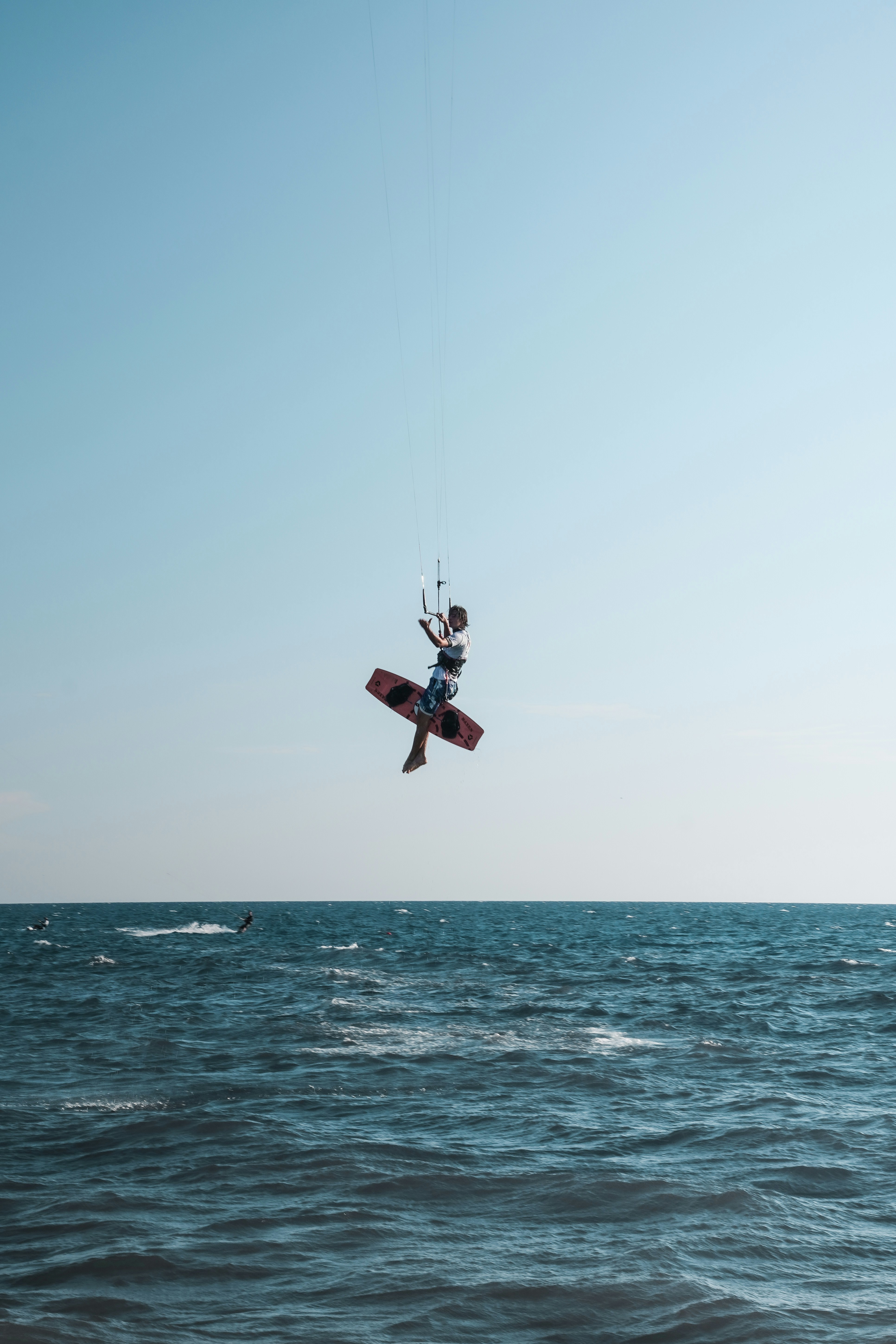 Elevated Thrill: A Kiteboarder's Ascent