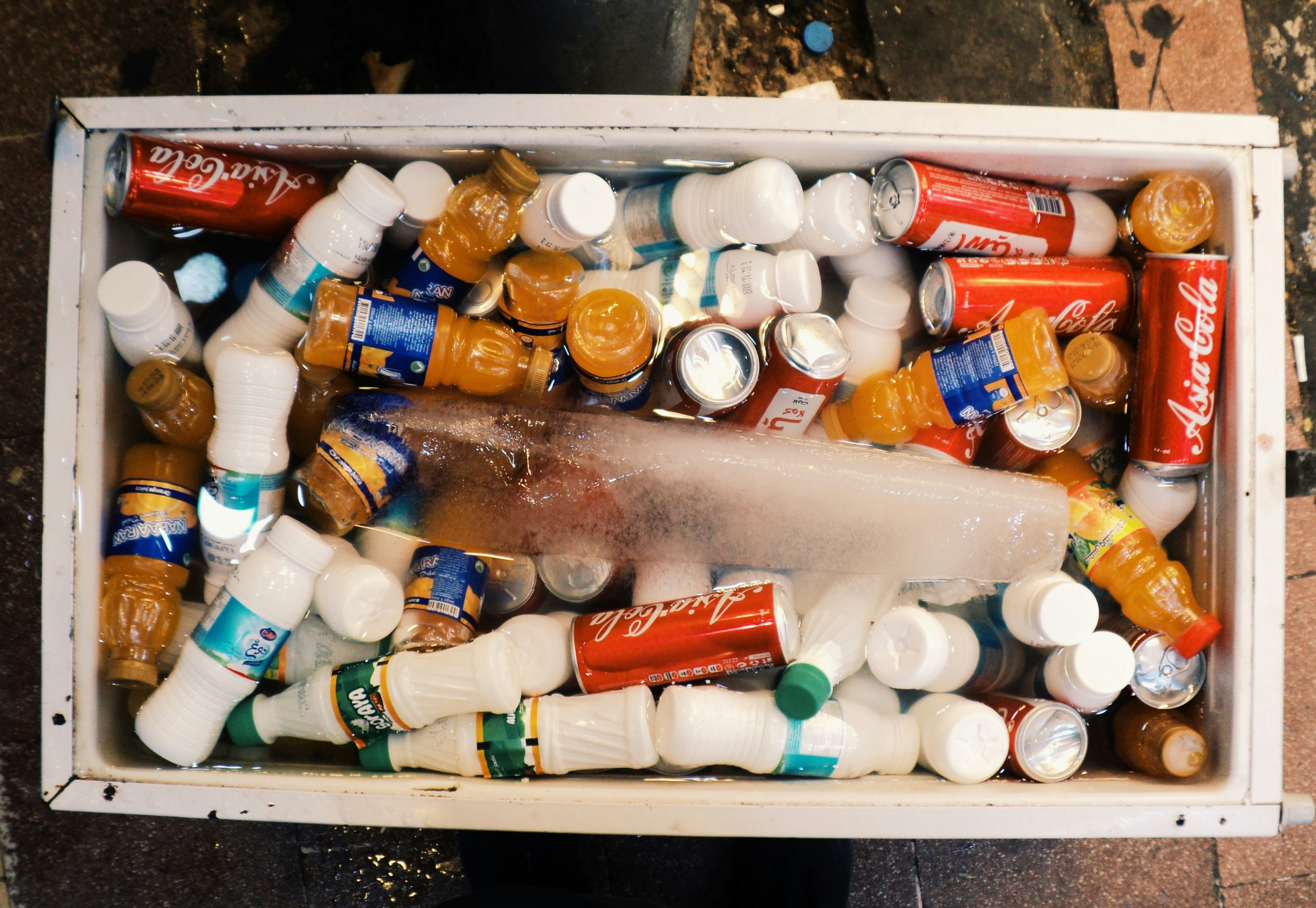 A quiet oasis on a hot day. | Cooler filled with drinks and ice