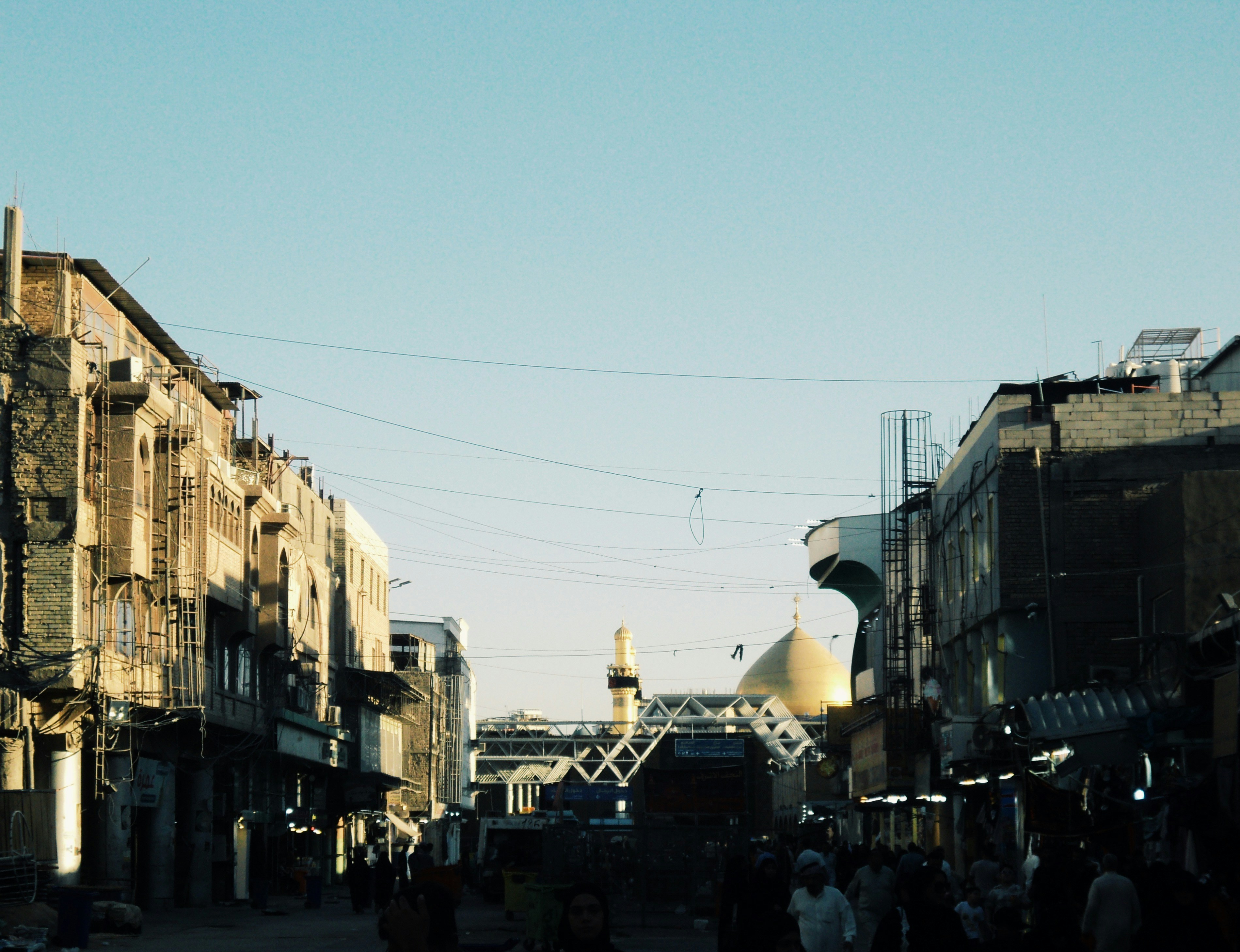 More than a street, it's a feeling of home for the soul. | Street scene with buildings and a golden dome.