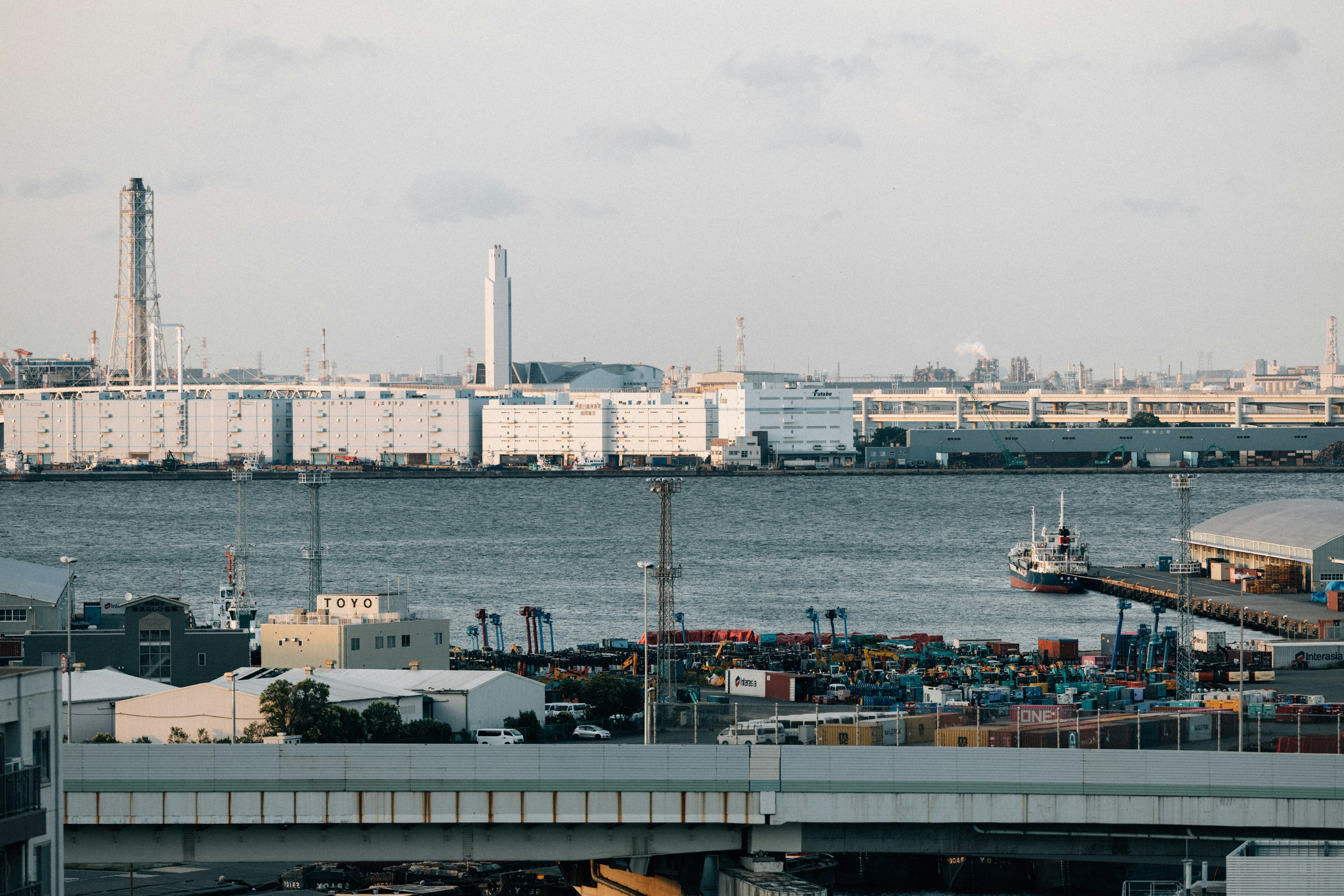 Industrial waterfront with cargo containers and buildings photo – Free ...