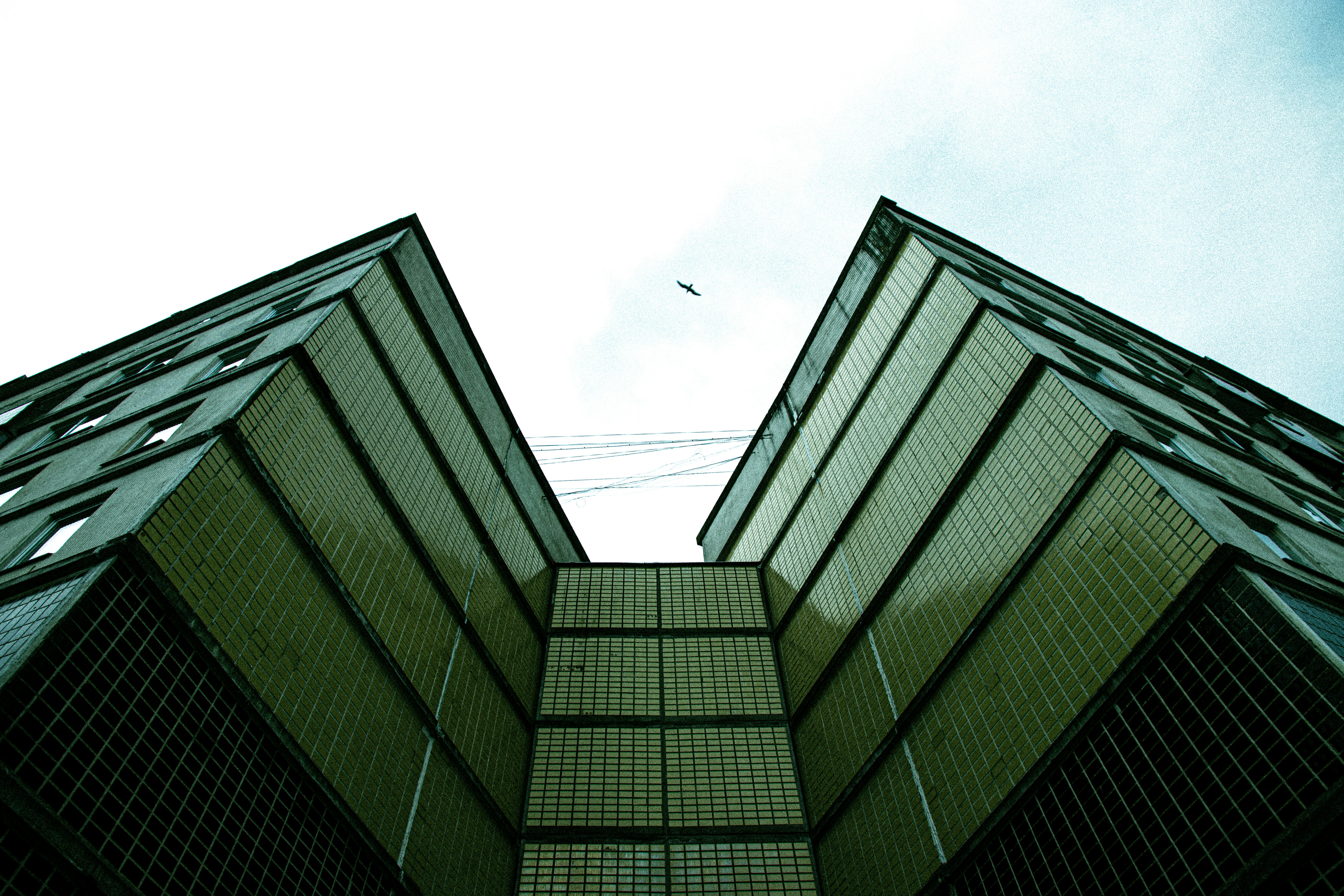 Modern building facade with geometric patterns and angular design.
