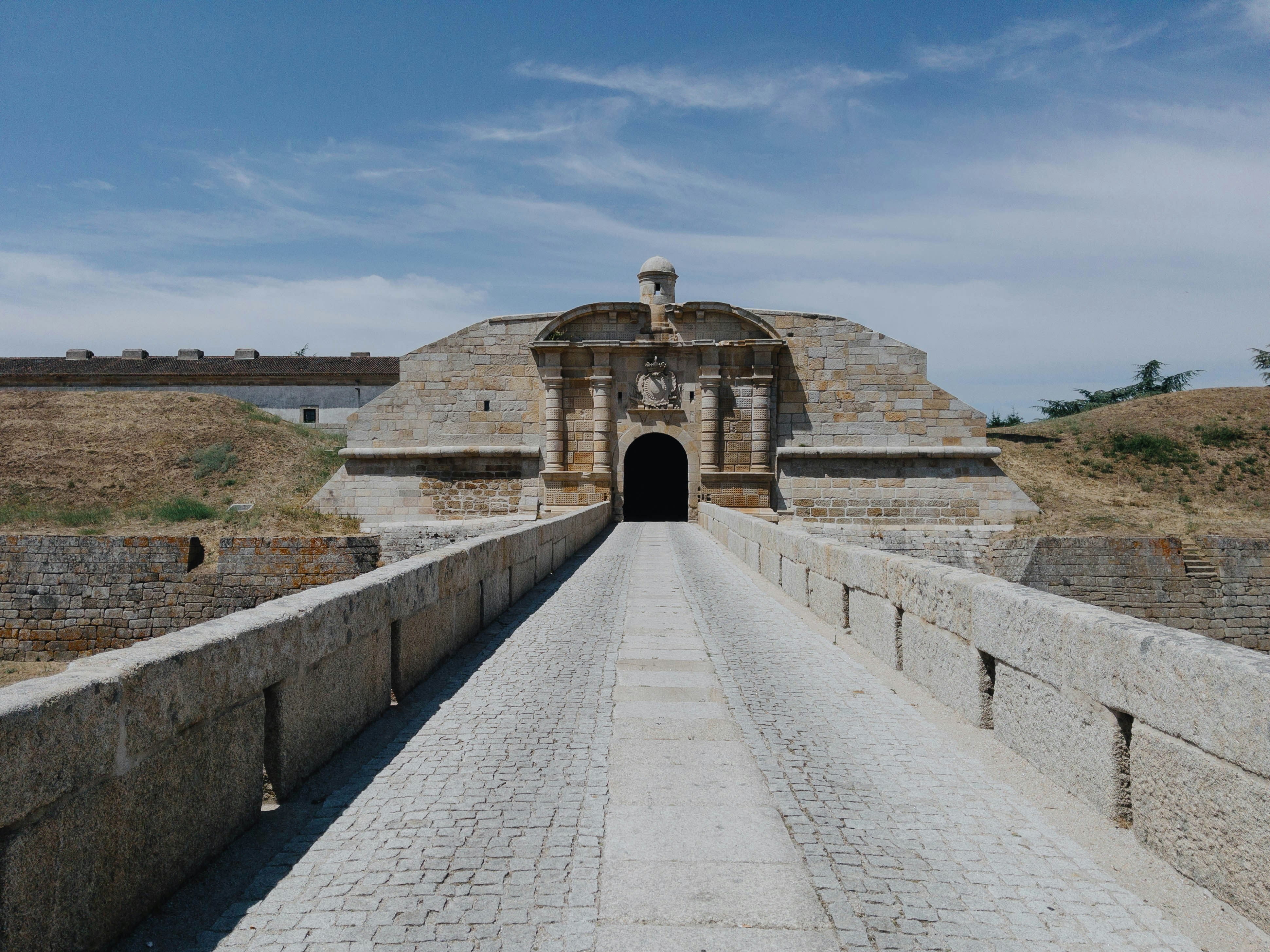 Stone bridge leads to historic fortress entrance photo – Free Iphone ...