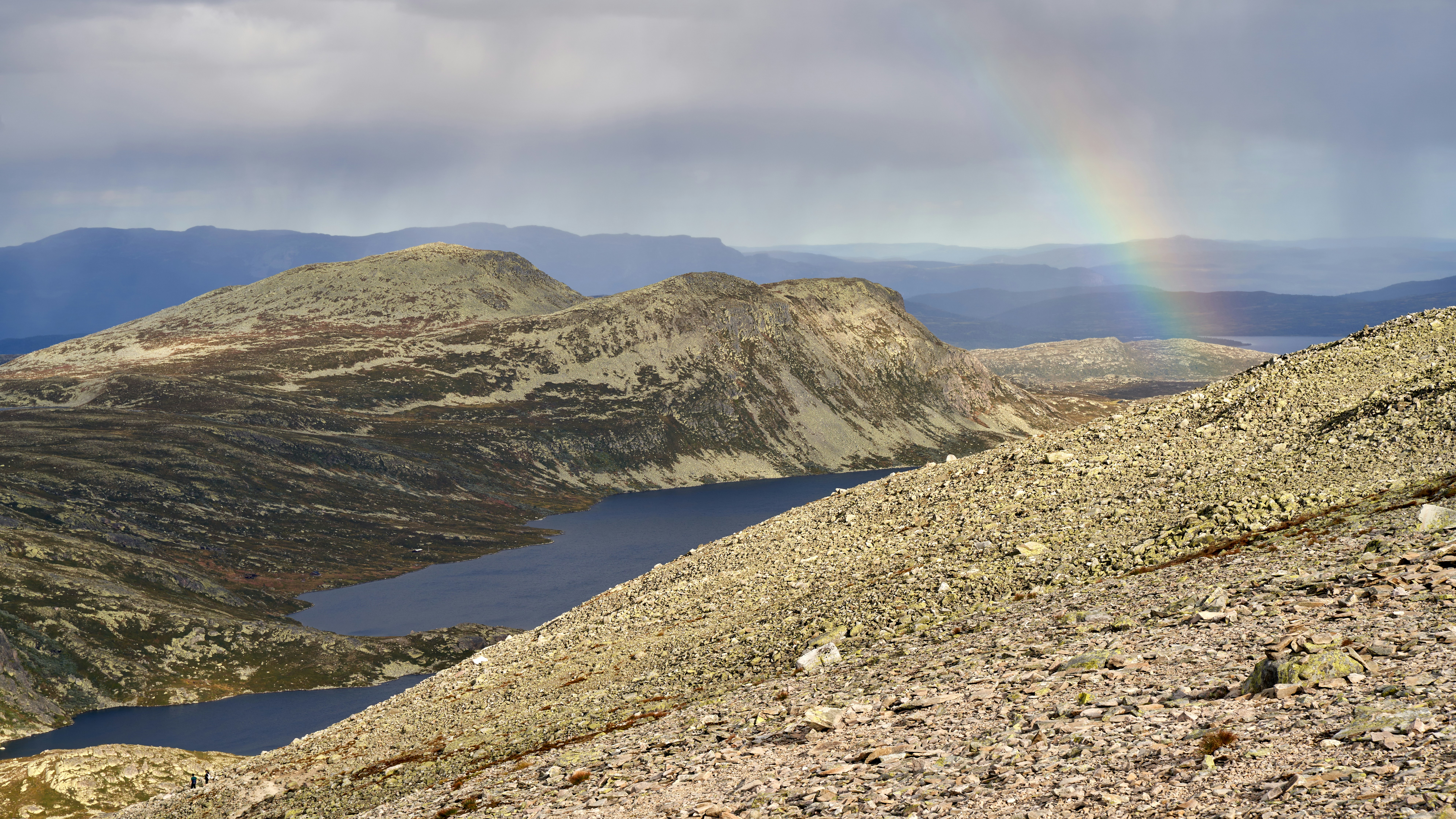 Whispers of the Highlands: A Rainbow's Embrace