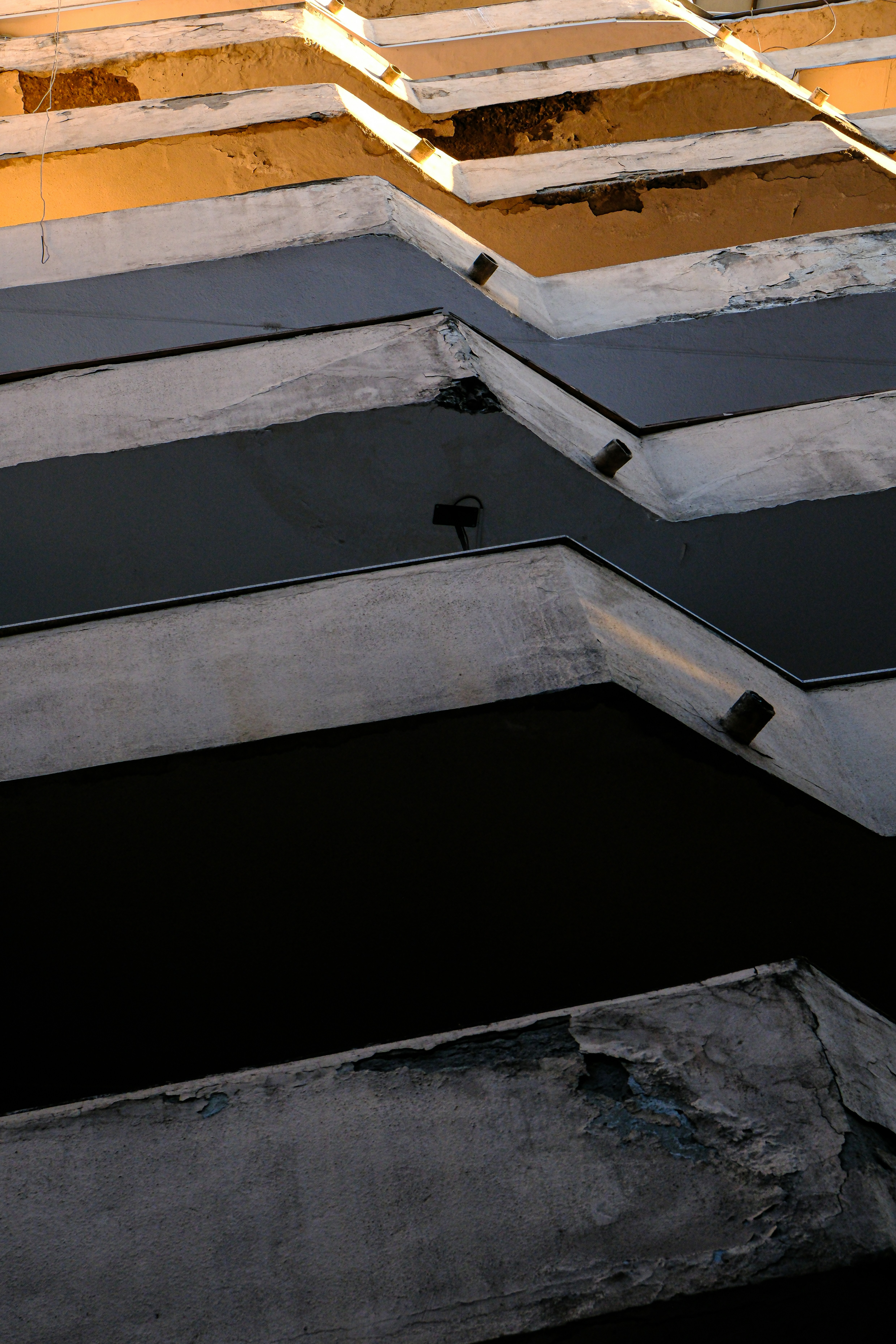 Sunlit Layers: Angular Concrete Ramps in Soft Shadow