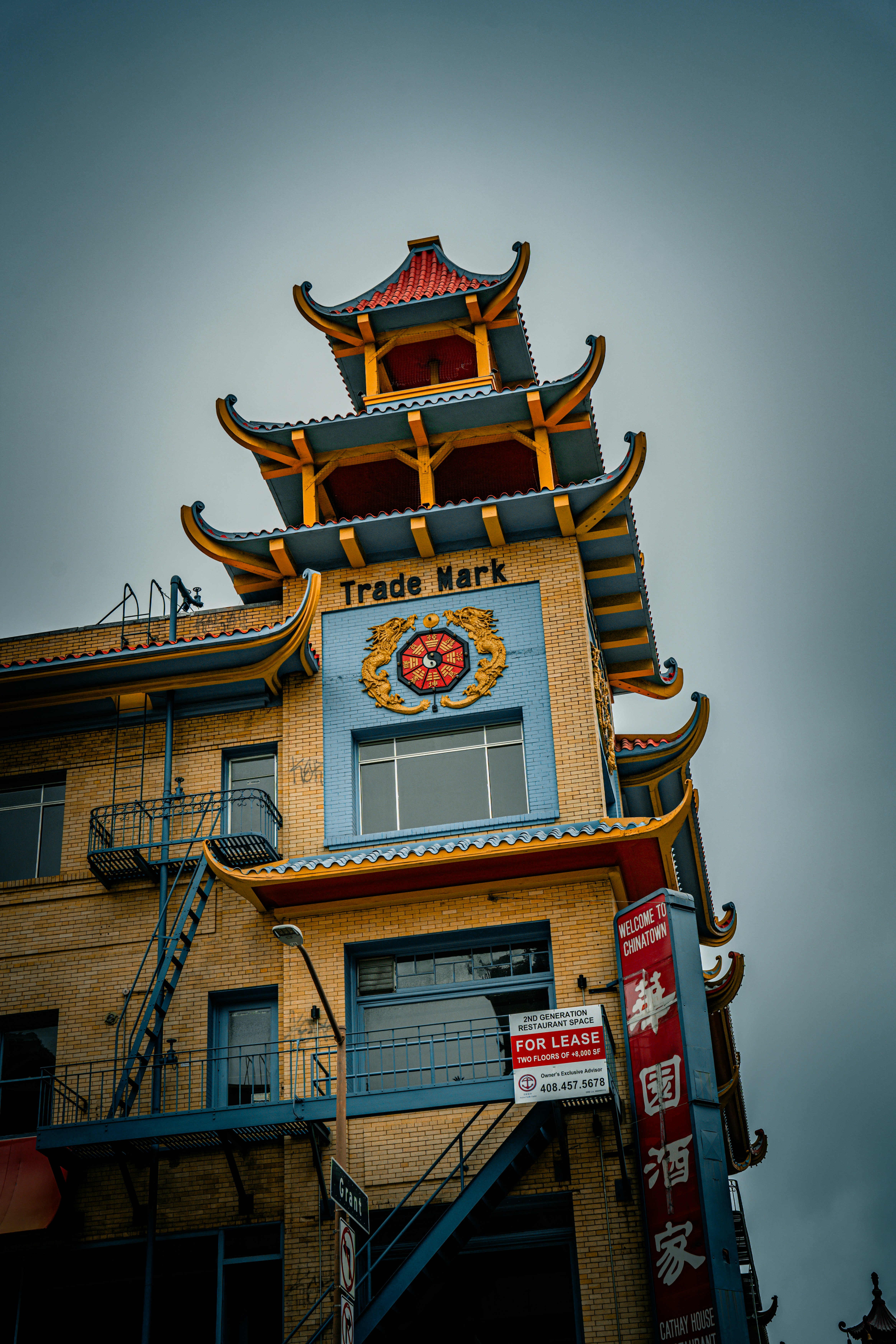 Traditional asian architecture adorns a building in chinatown.