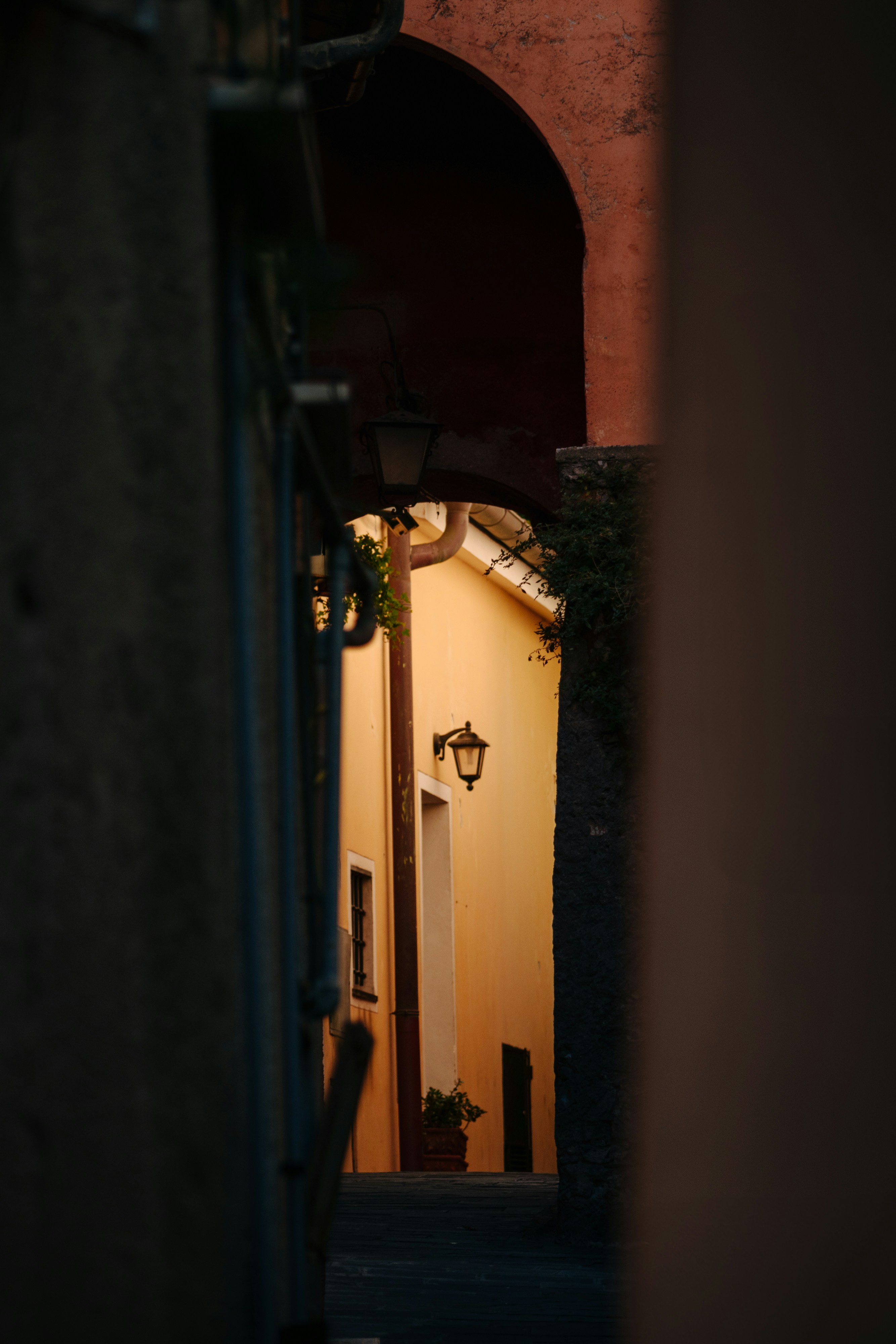 Narrow european street with warm light.