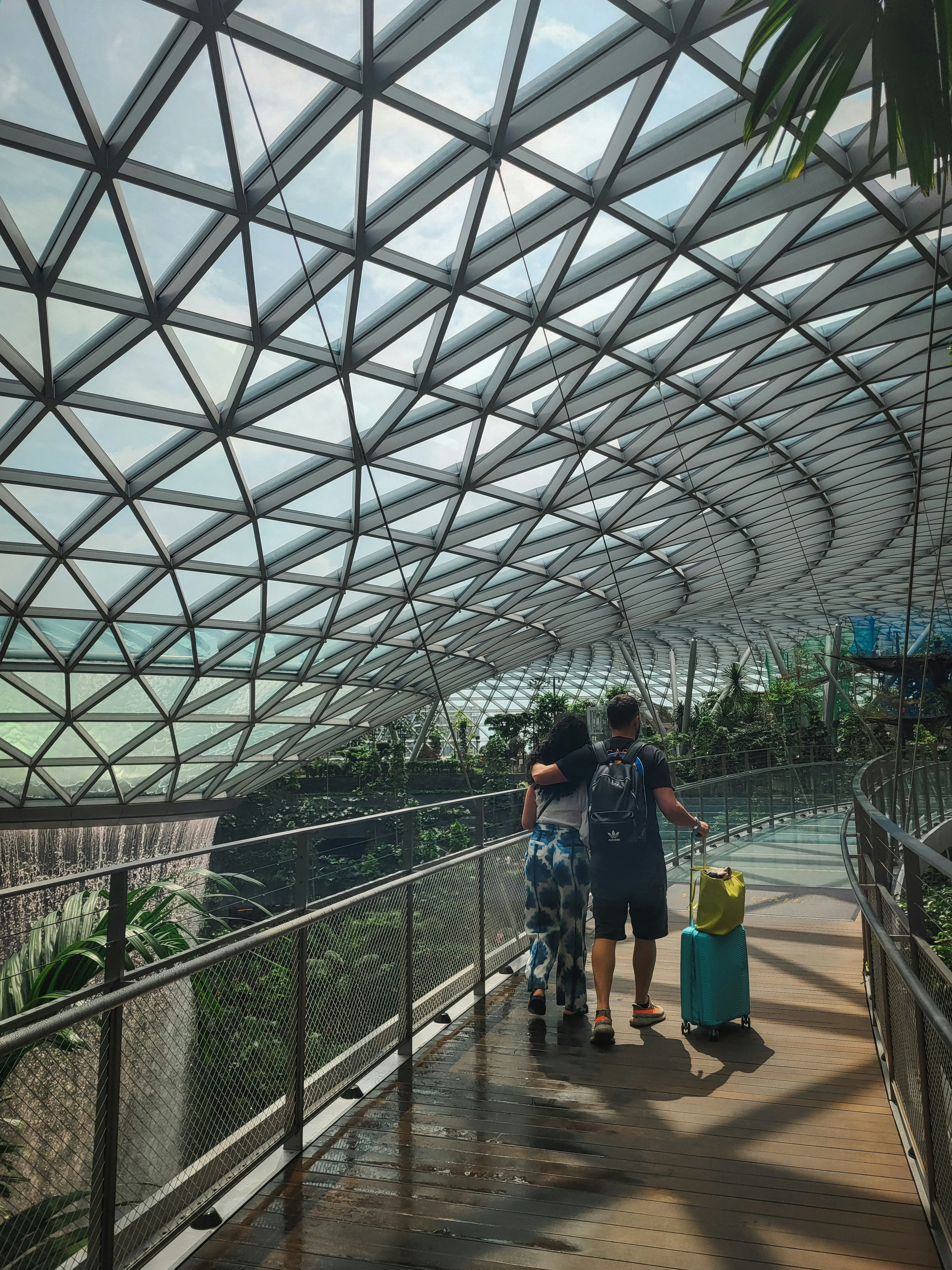 Embrace on a Glass Skyway Beneath a Diamond-Lattice Canopy
