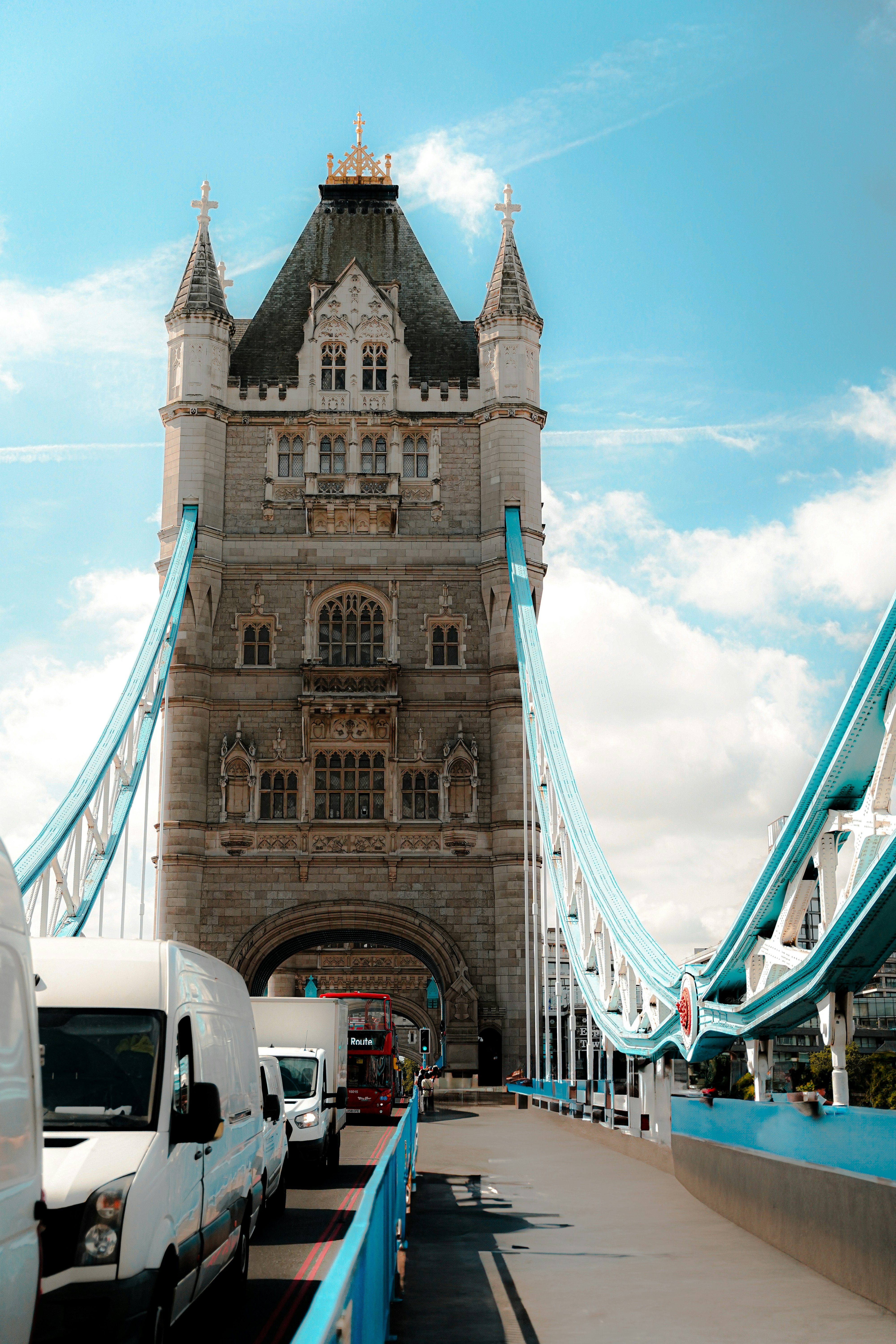 Tower bridge in london with traffic on a sunny day.
