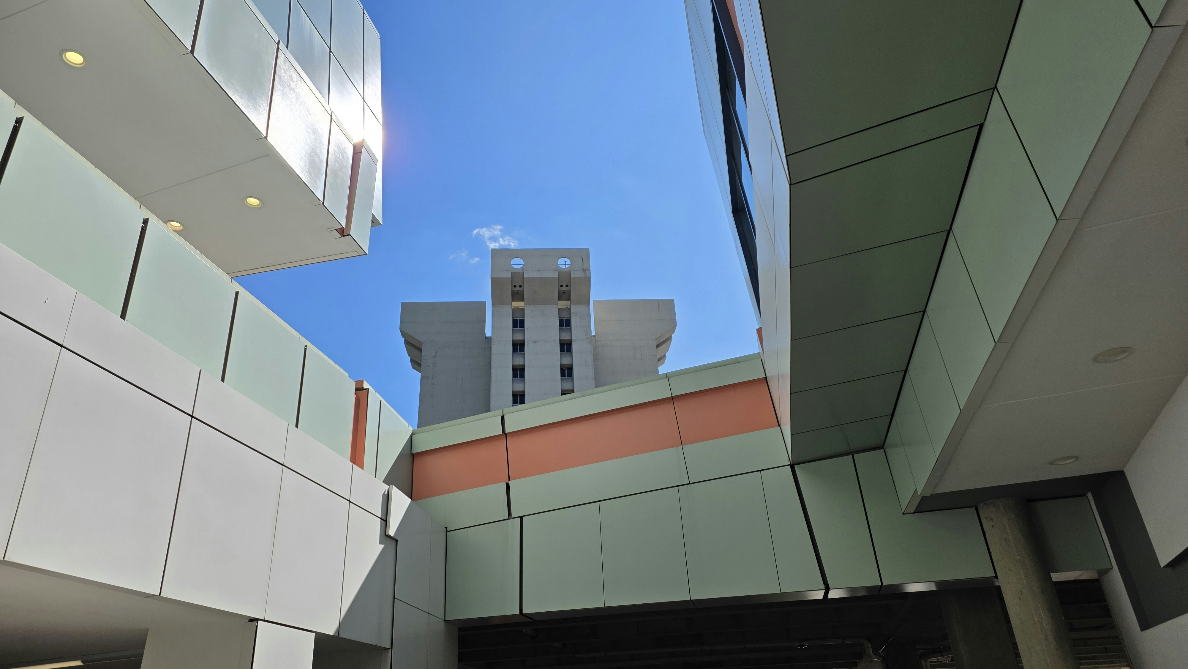 Modern buildings with glass and metal under blue sky