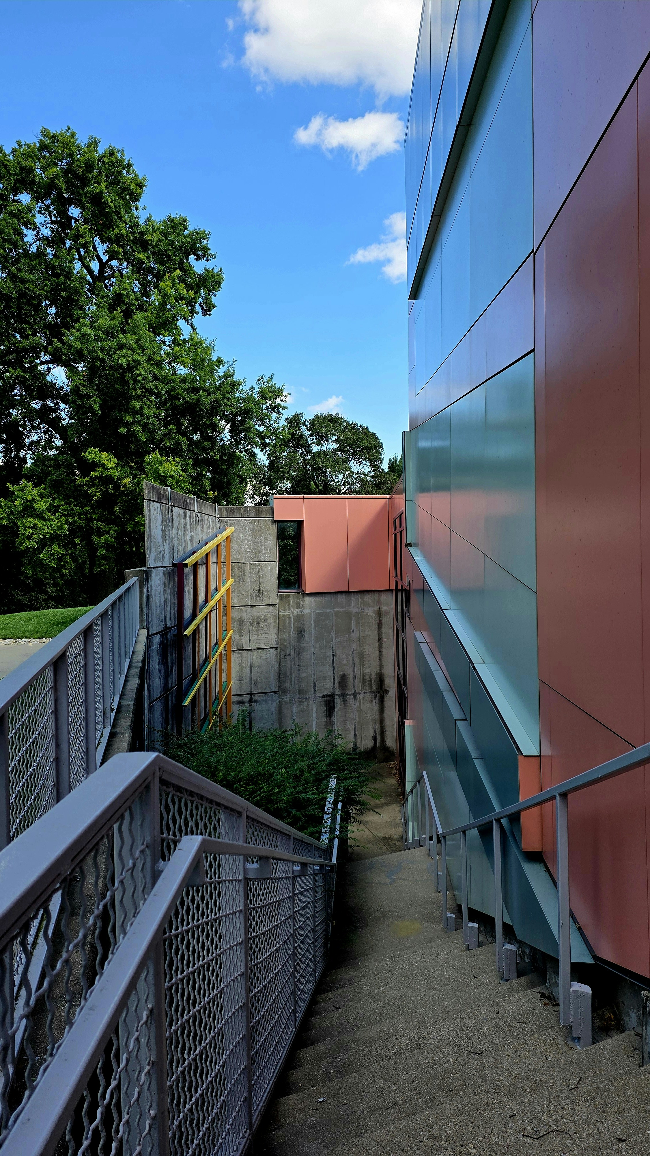 Modern building with metal stairs and colorful panels