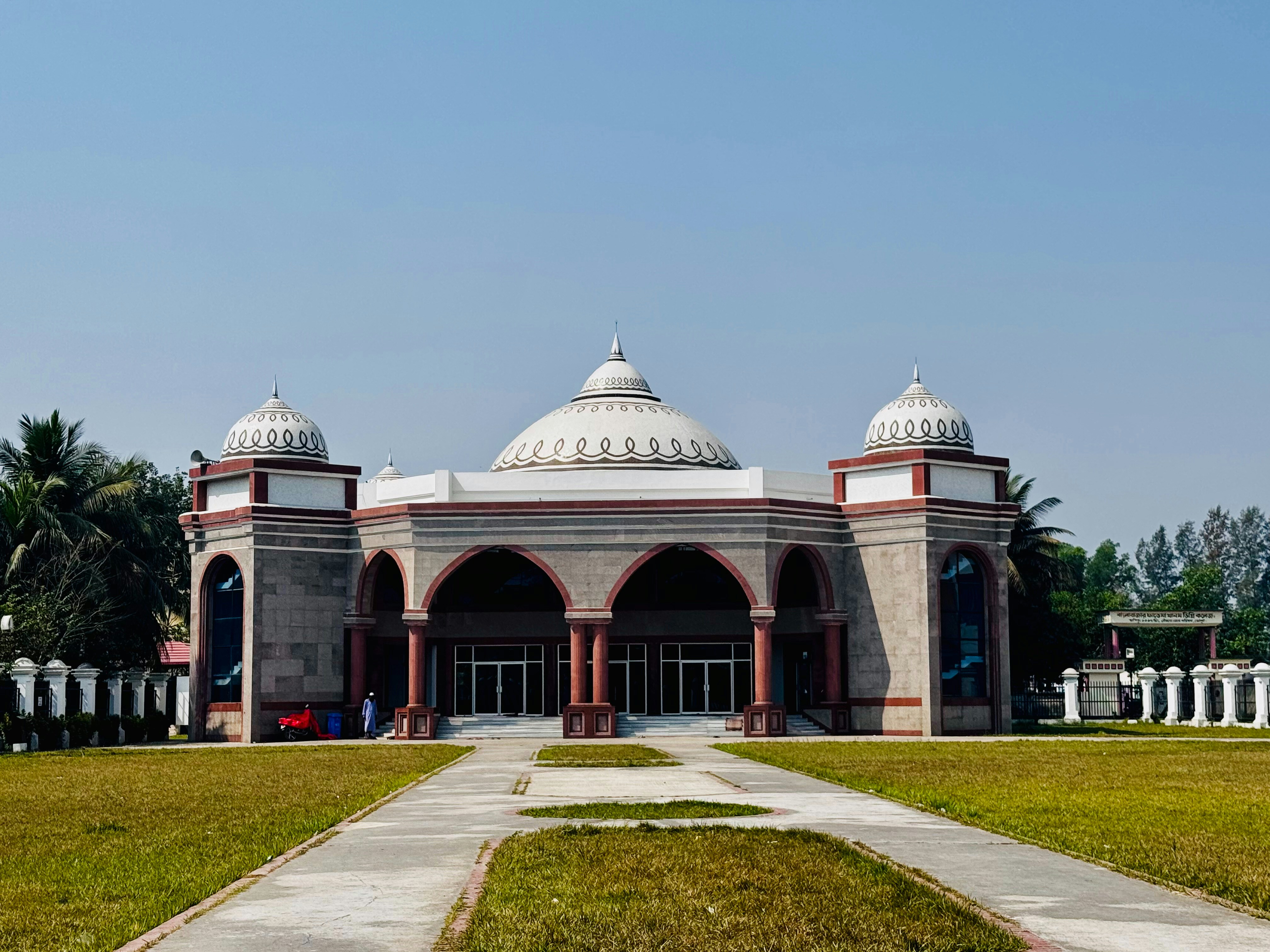 Grand building with domes and arched entrance