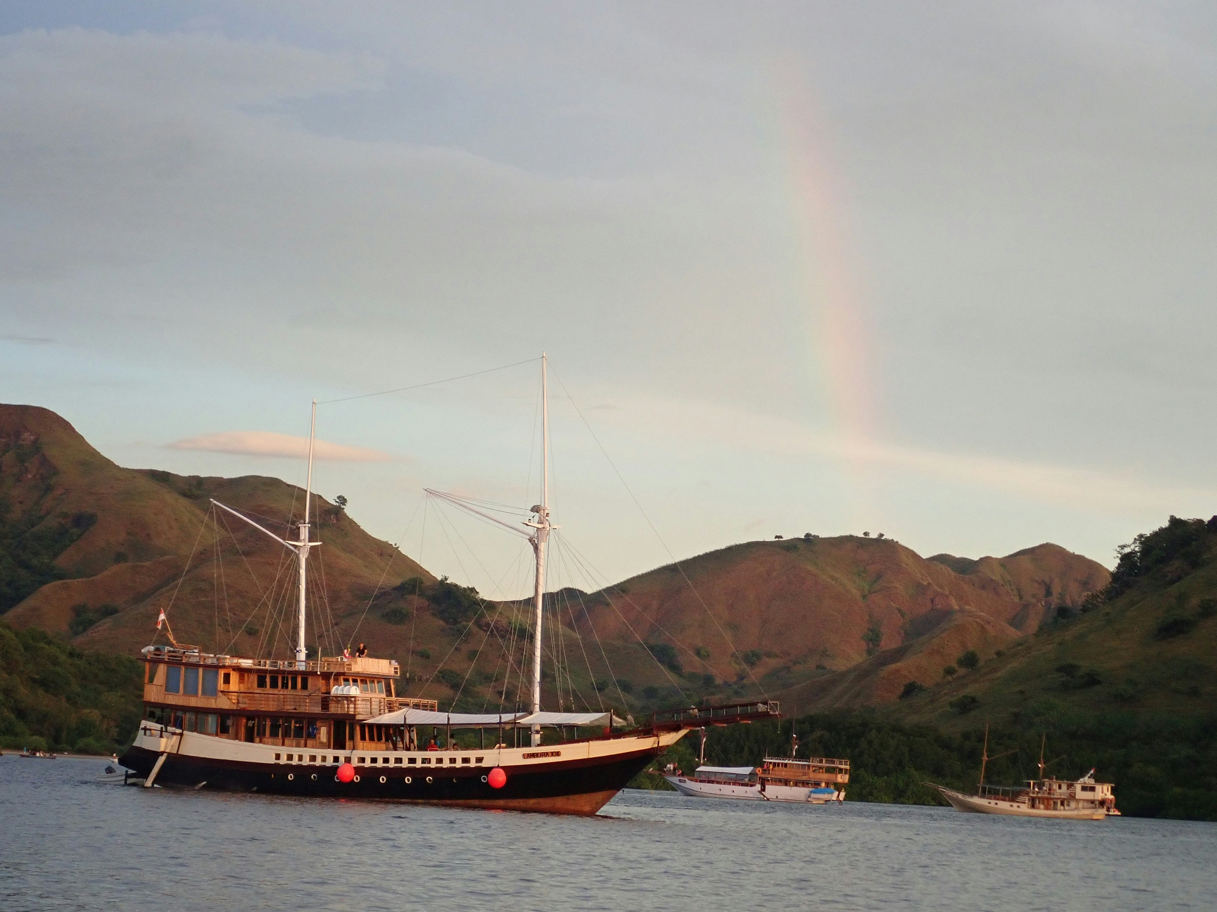 Sailing Through Serenity: A Rainbow's Embrace