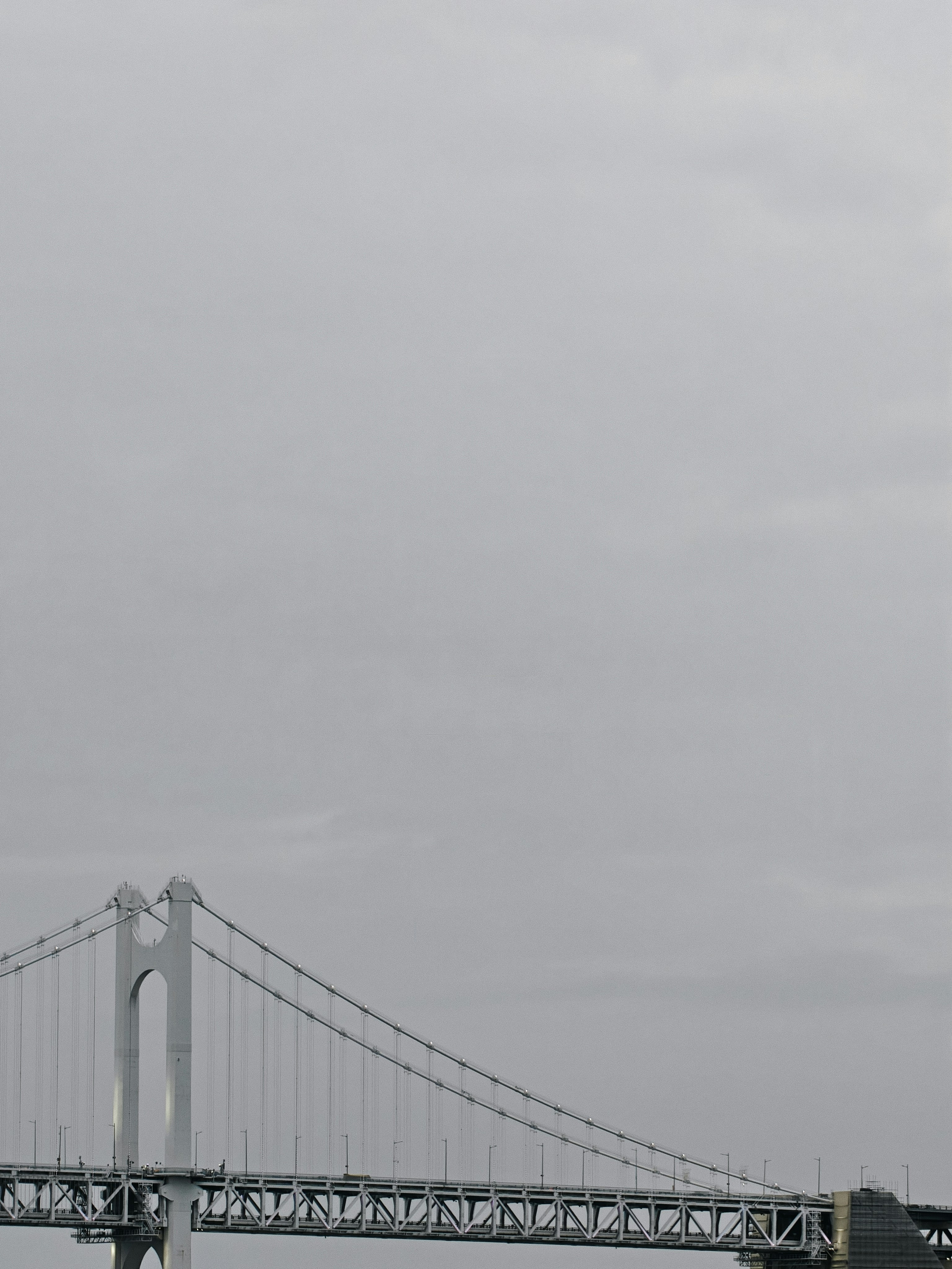 Bridging the gap. | Suspension bridge against a cloudy sky