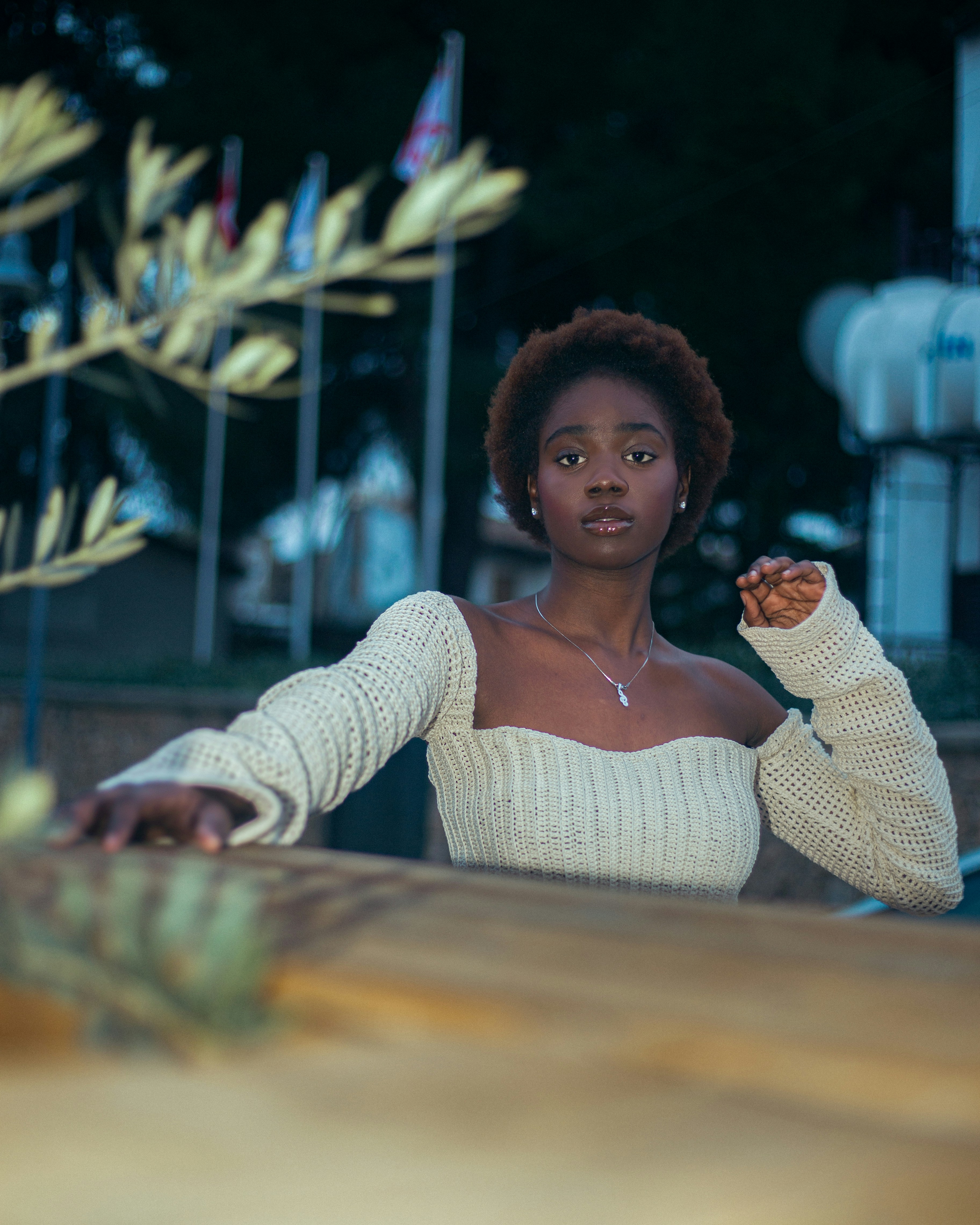 Cream Knit Portrait Under Neon Evening Glow